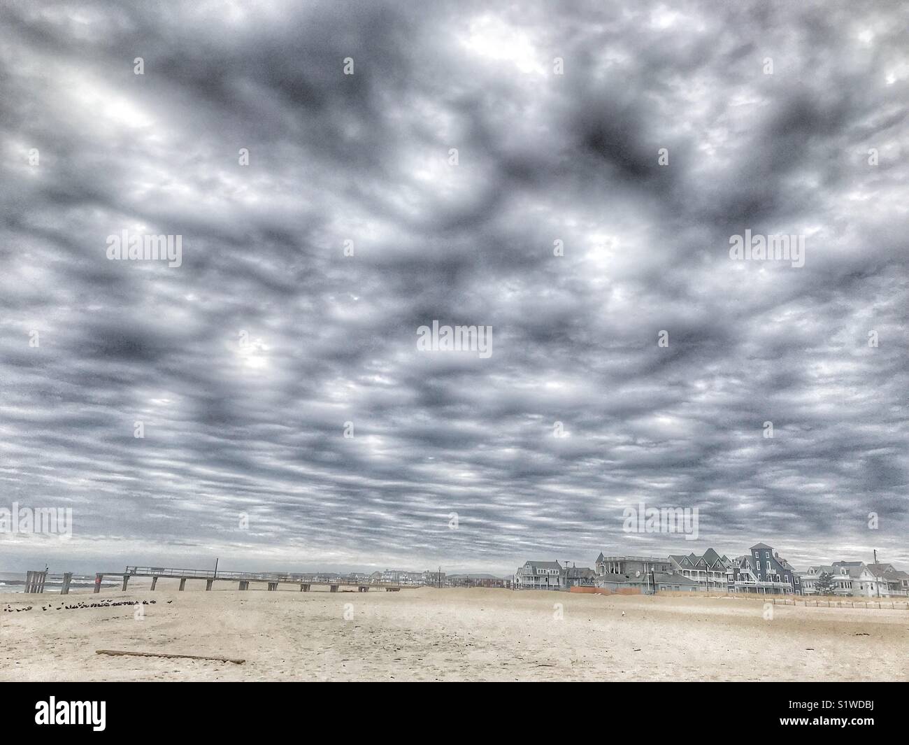 Grey clouds and beach Stock Photo - Alamy