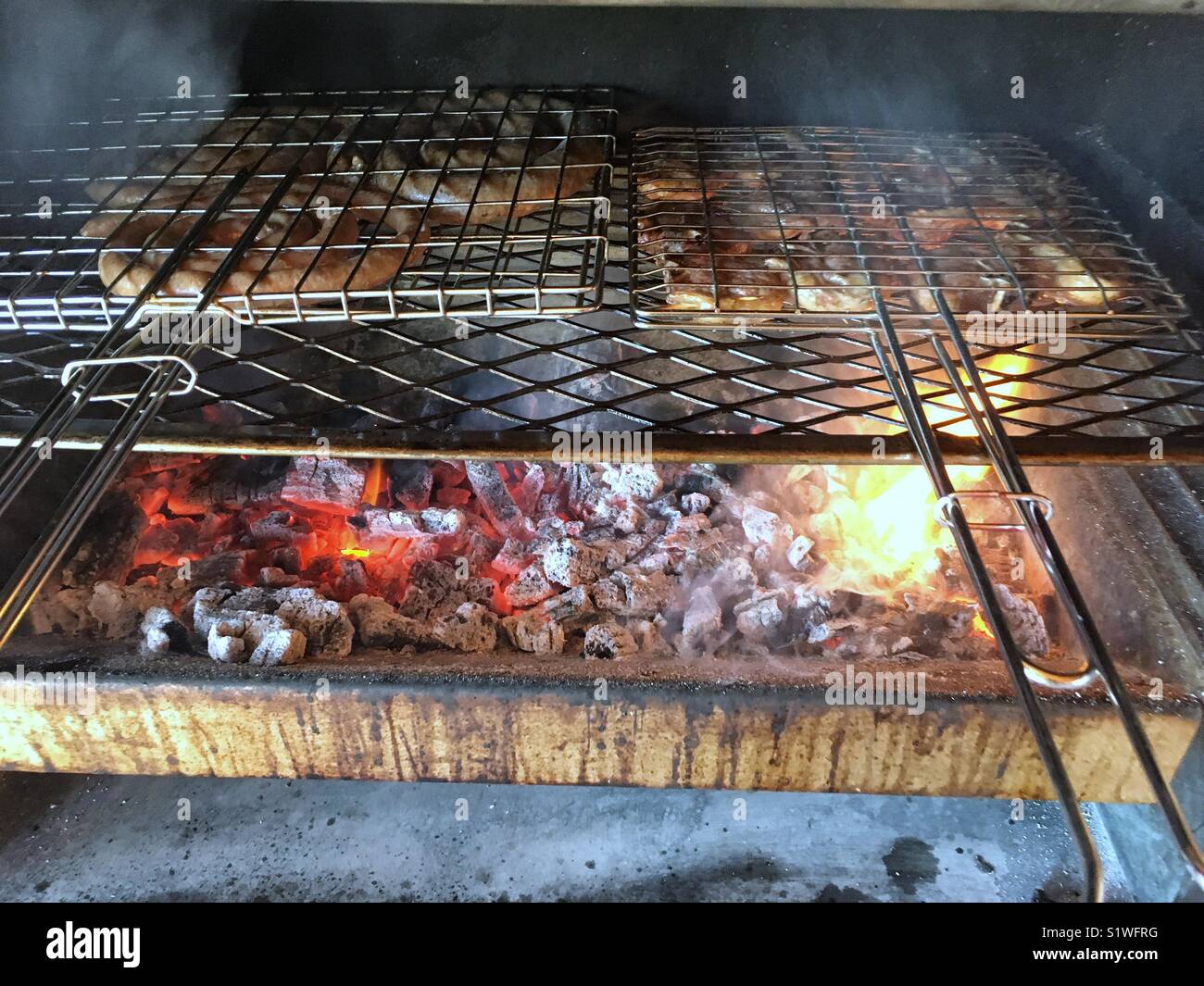 Cooking meat over fire hi-res stock photography and images - Alamy