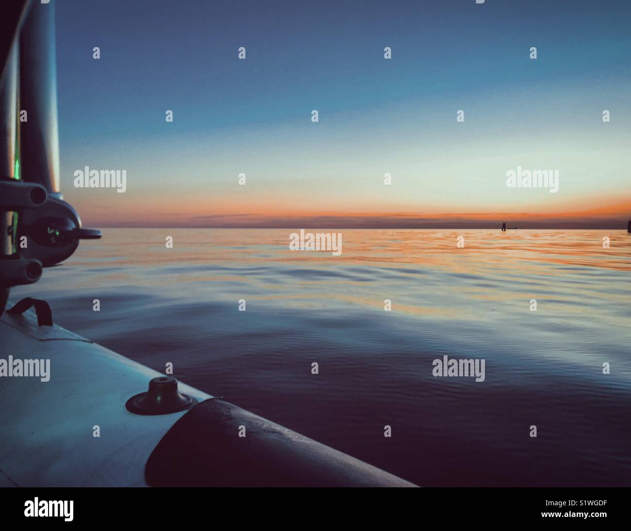 Sunset from a boat Stock Photo - Alamy