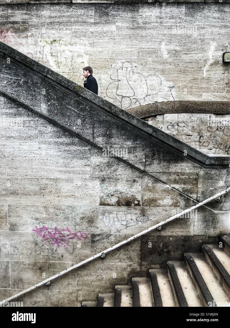 Man walking staircase hi-res stock photography and images - Alamy