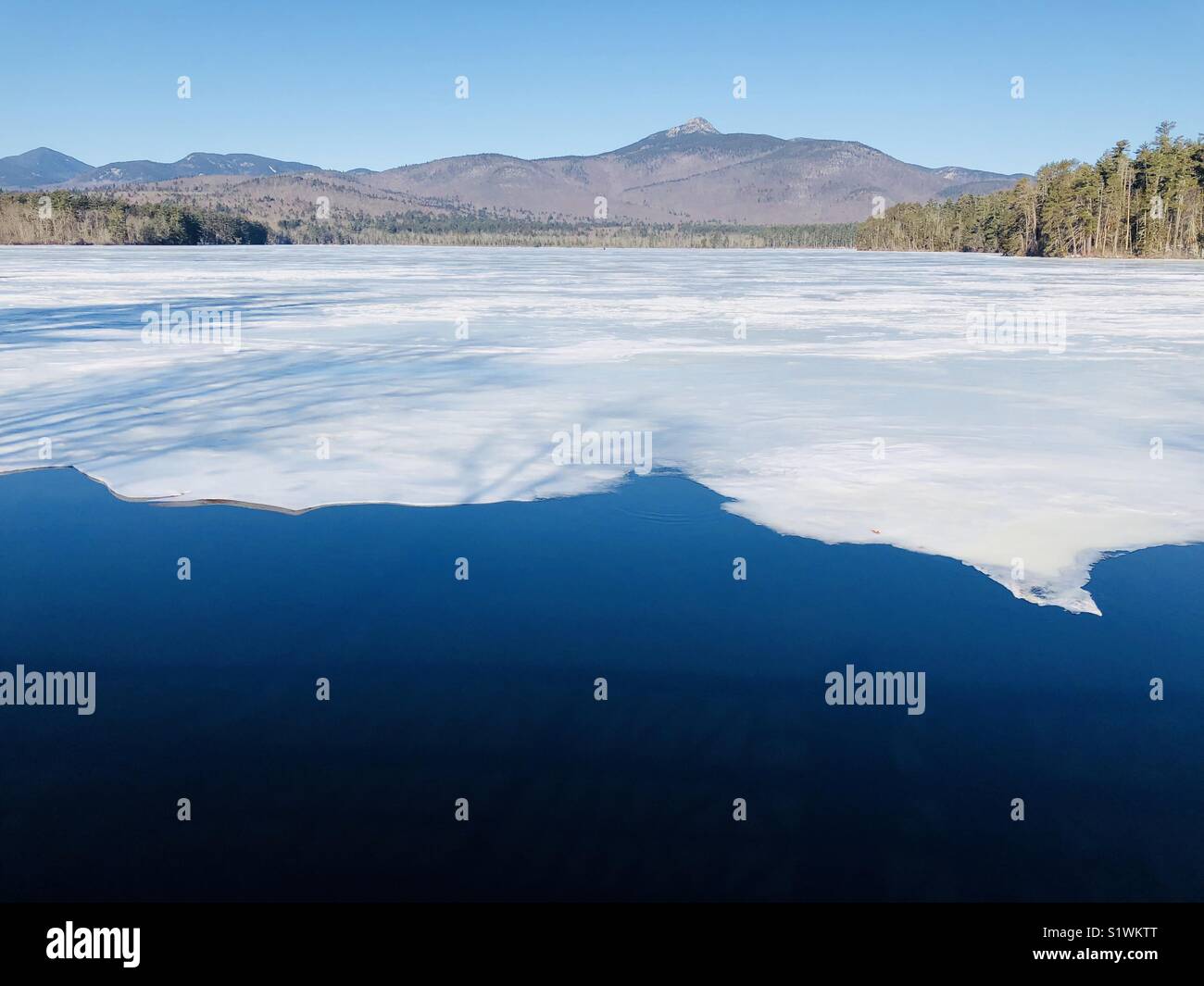 Chocorua lake with Chocorua mountain in the background. Frozen Chocorua ...