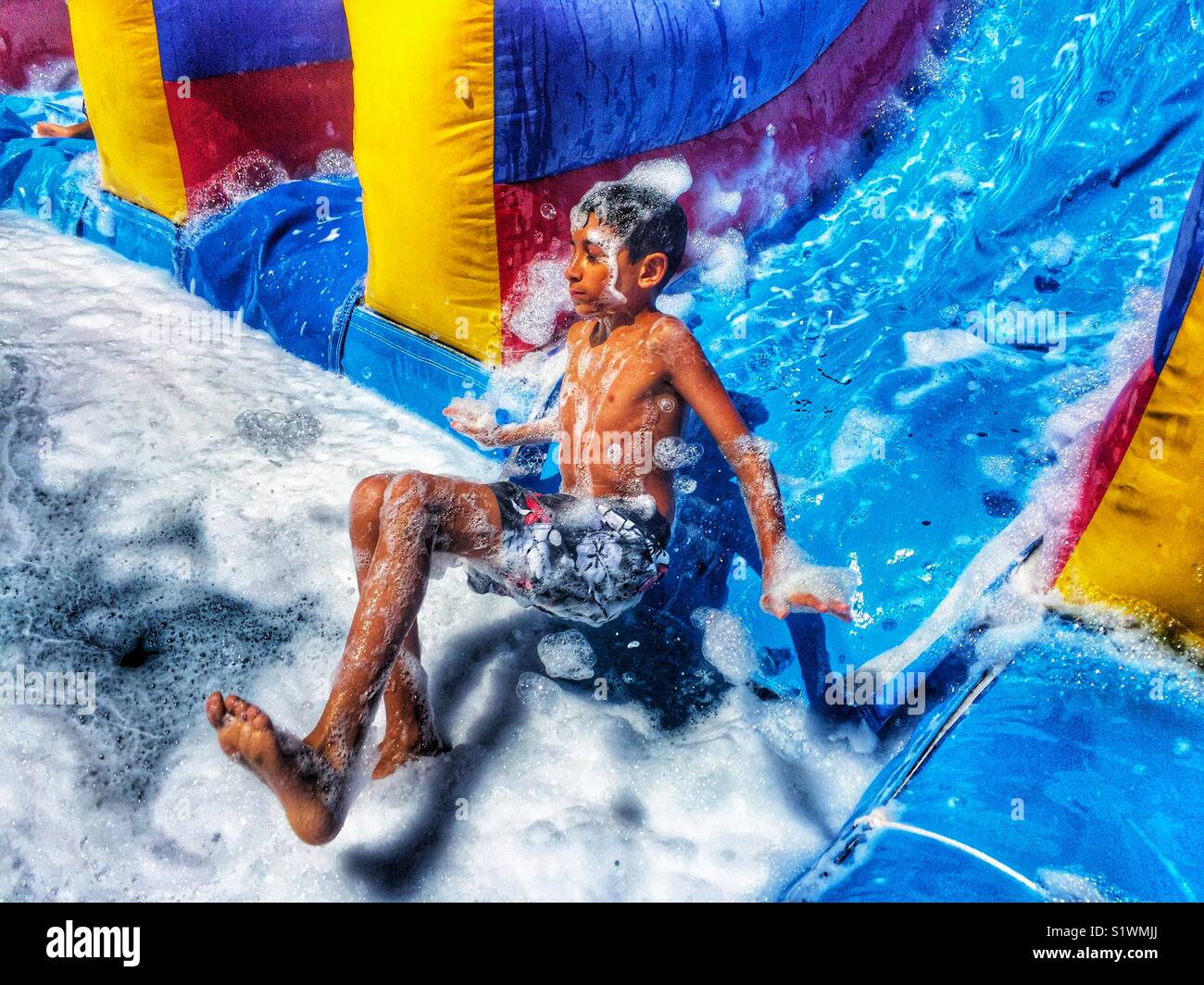 Water slide child hi-res stock photography and images - Alamy