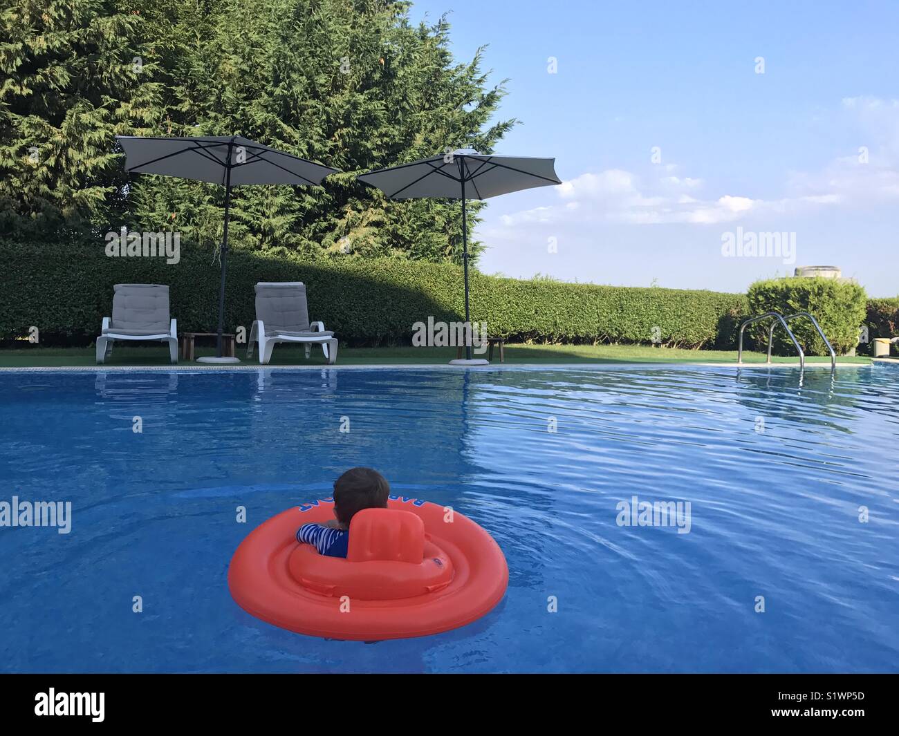 Boy with inflatable hi-res stock photography and images - Alamy