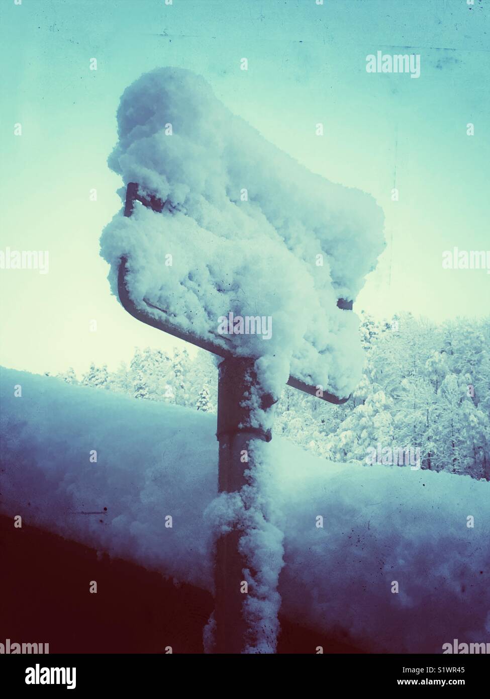 Snow covered road sign Stock Photo - Alamy