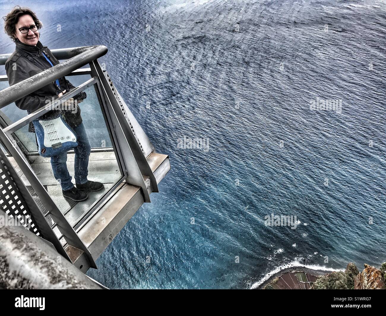 Person standing on the glass skywalk viewing platform, 580m above the ...