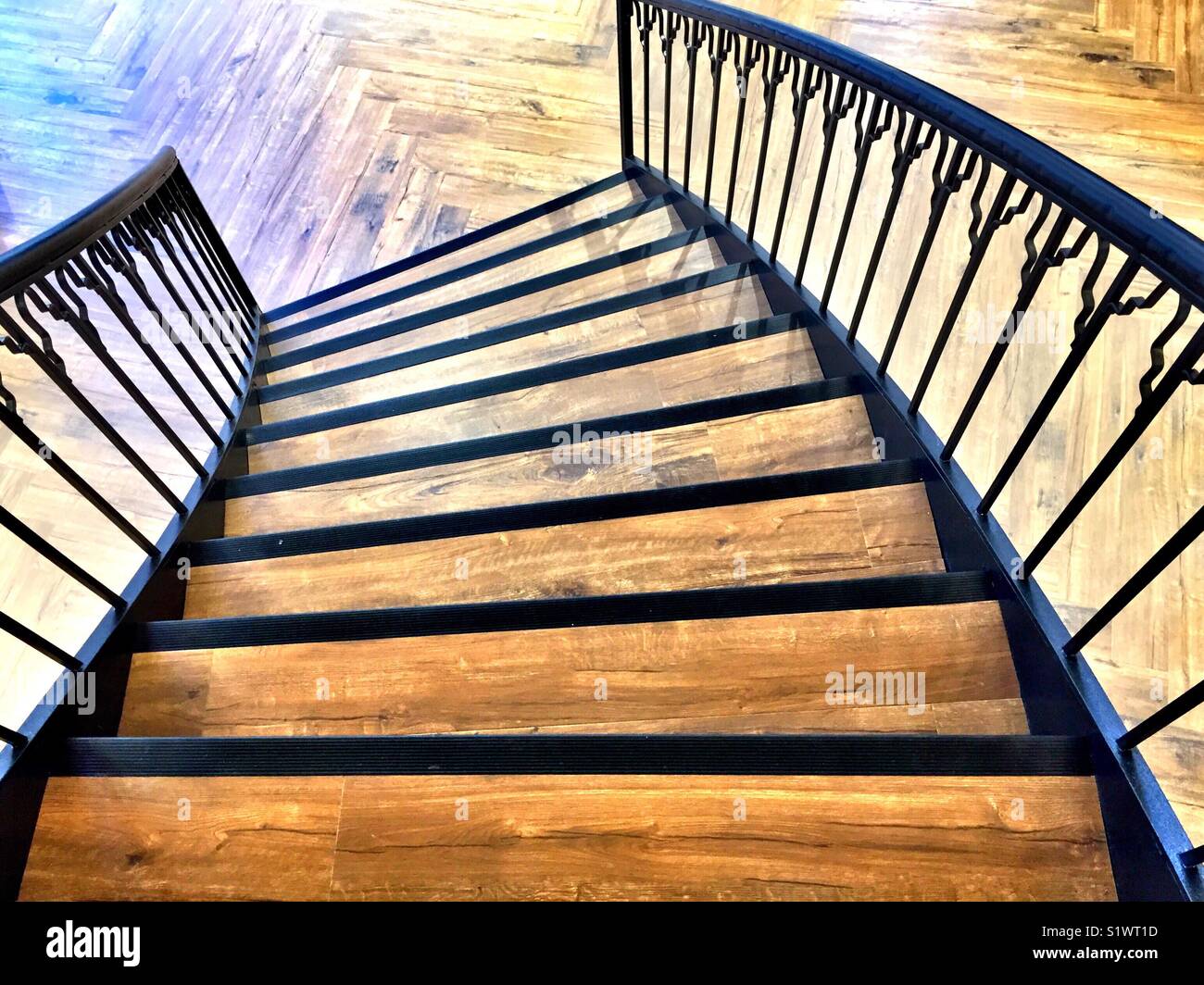 Curved wooden and metal staircase, United States Stock Photo - Alamy