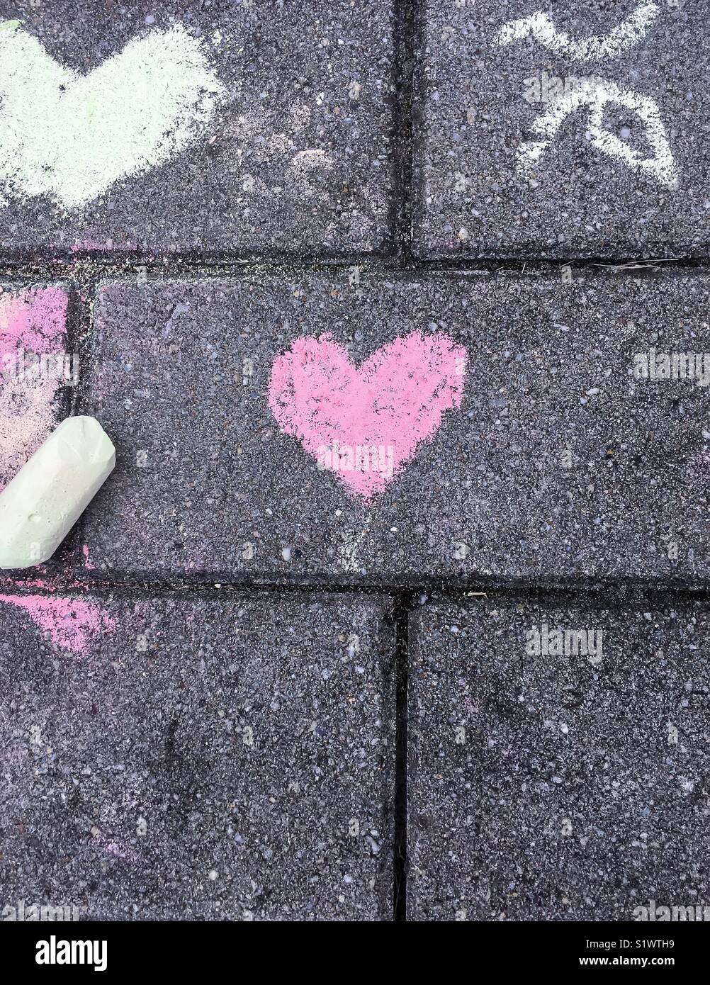 Kids playing with chalk hi-res stock photography and images - Alamy