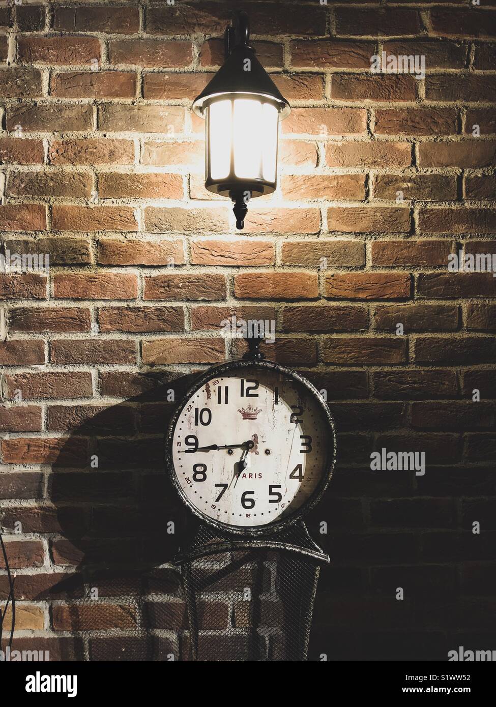 Vintage clock on brick wall Stock Photo - Alamy