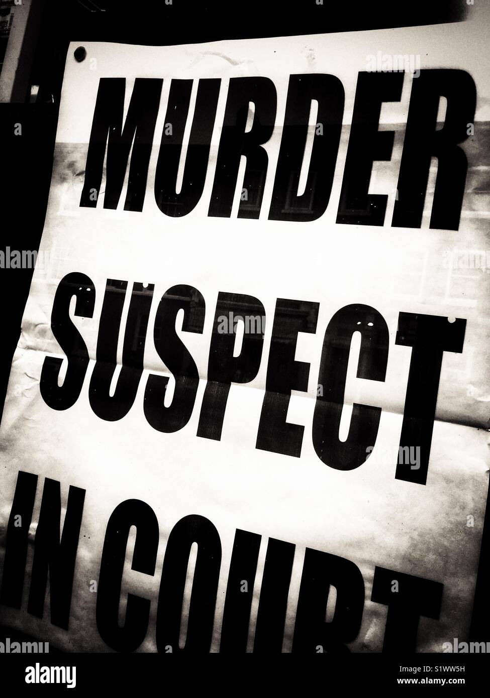 Crime murder suspect in court news poster Stock Photo - Alamy