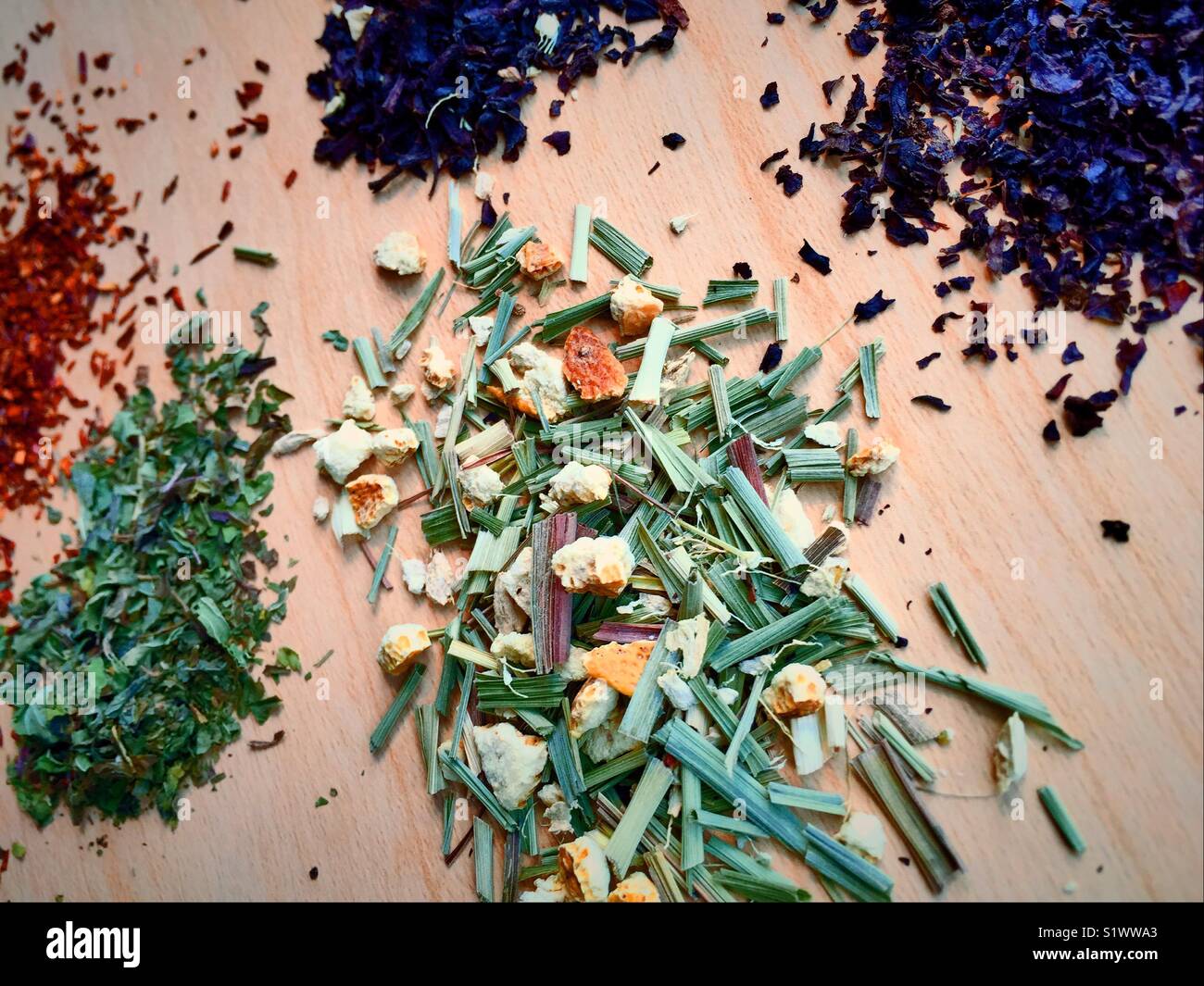 Piles of various flavored herbal loose teas Stock Photo - Alamy