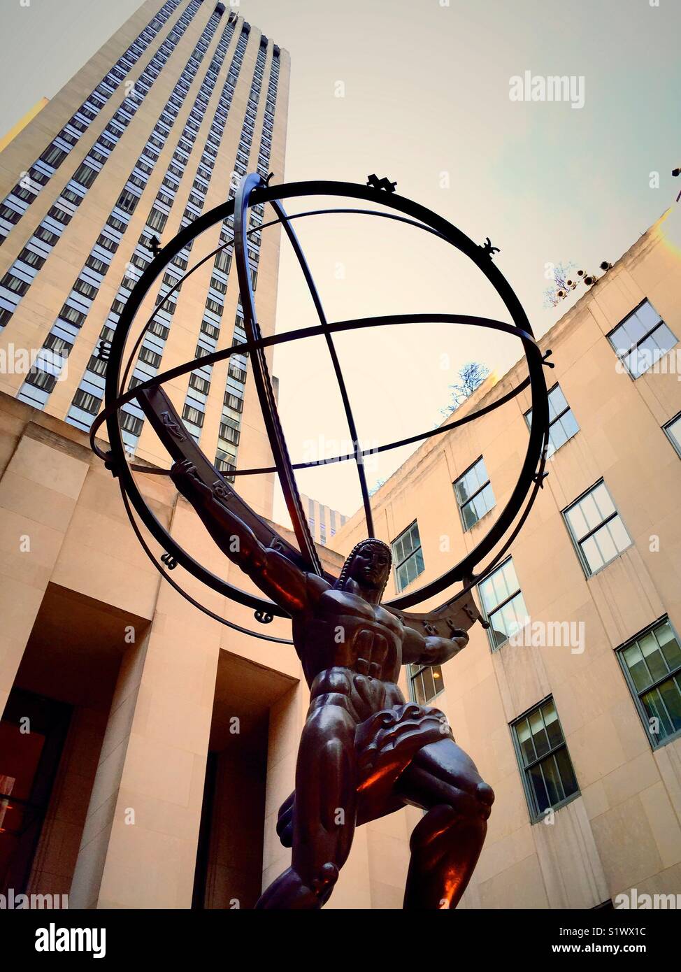 Statue of Apple is holding up the world, Rockefeller Center, New York ...