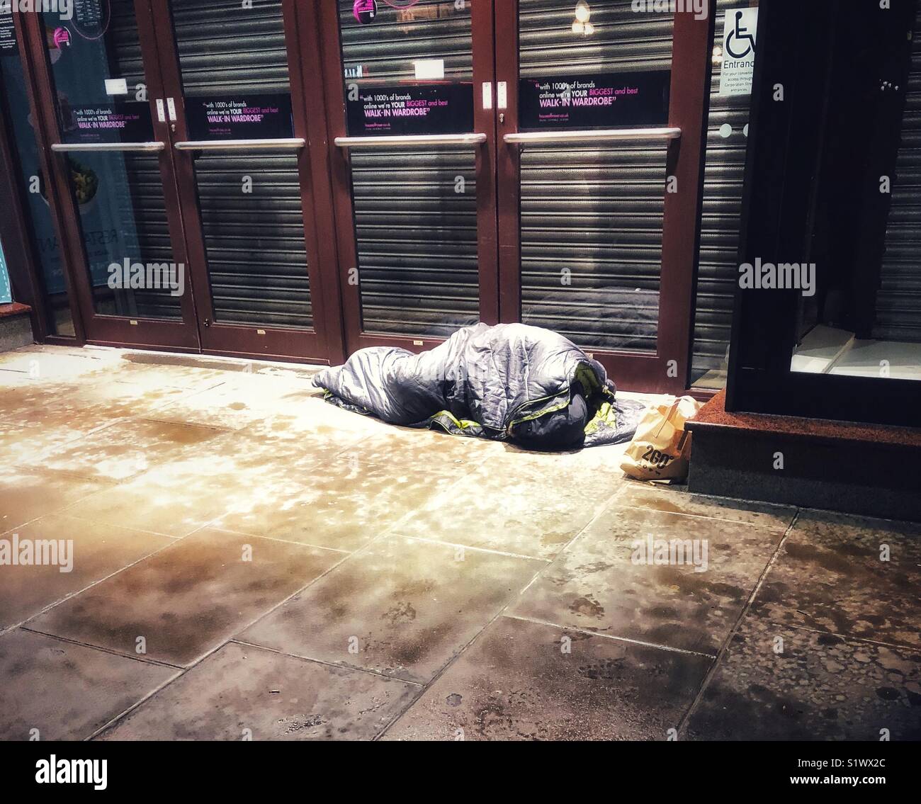 Homeless man sleeping in doorway in Birmingham Stock Photo - Alamy