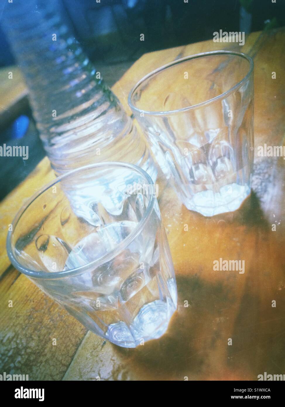 Glass of water on table Stock Photo - Alamy
