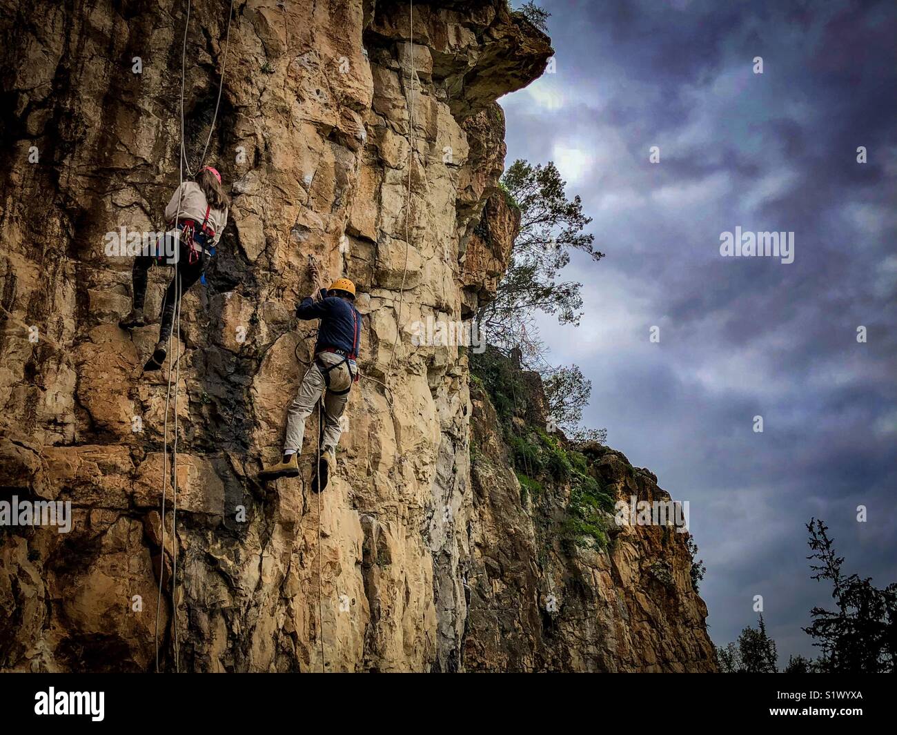 Rappelling on a wall Stock Photo - Alamy