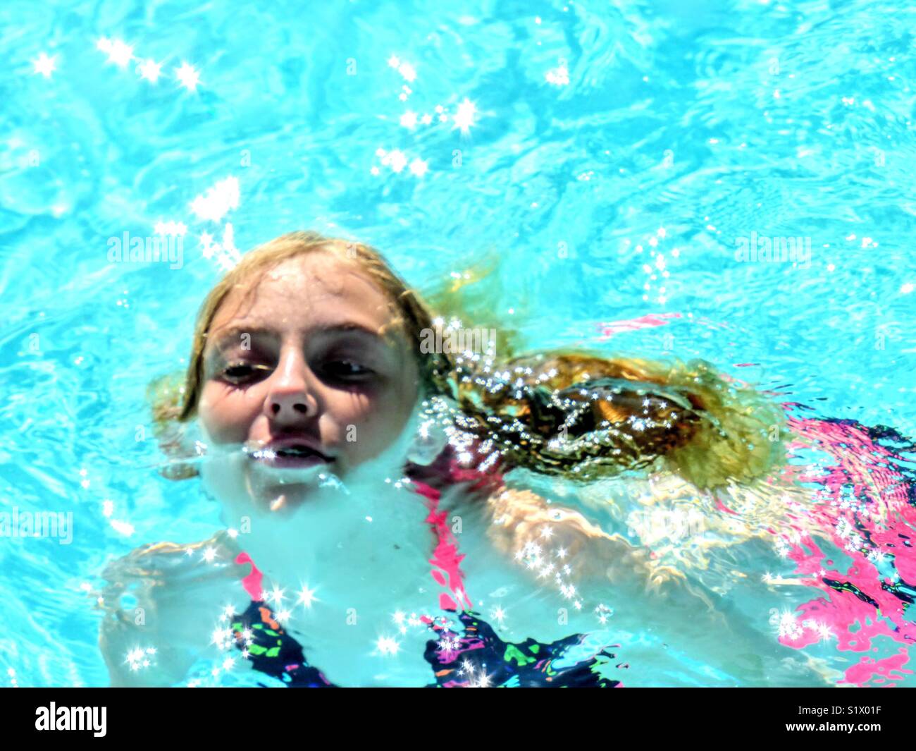 Floating blond girl Stock Photo - Alamy