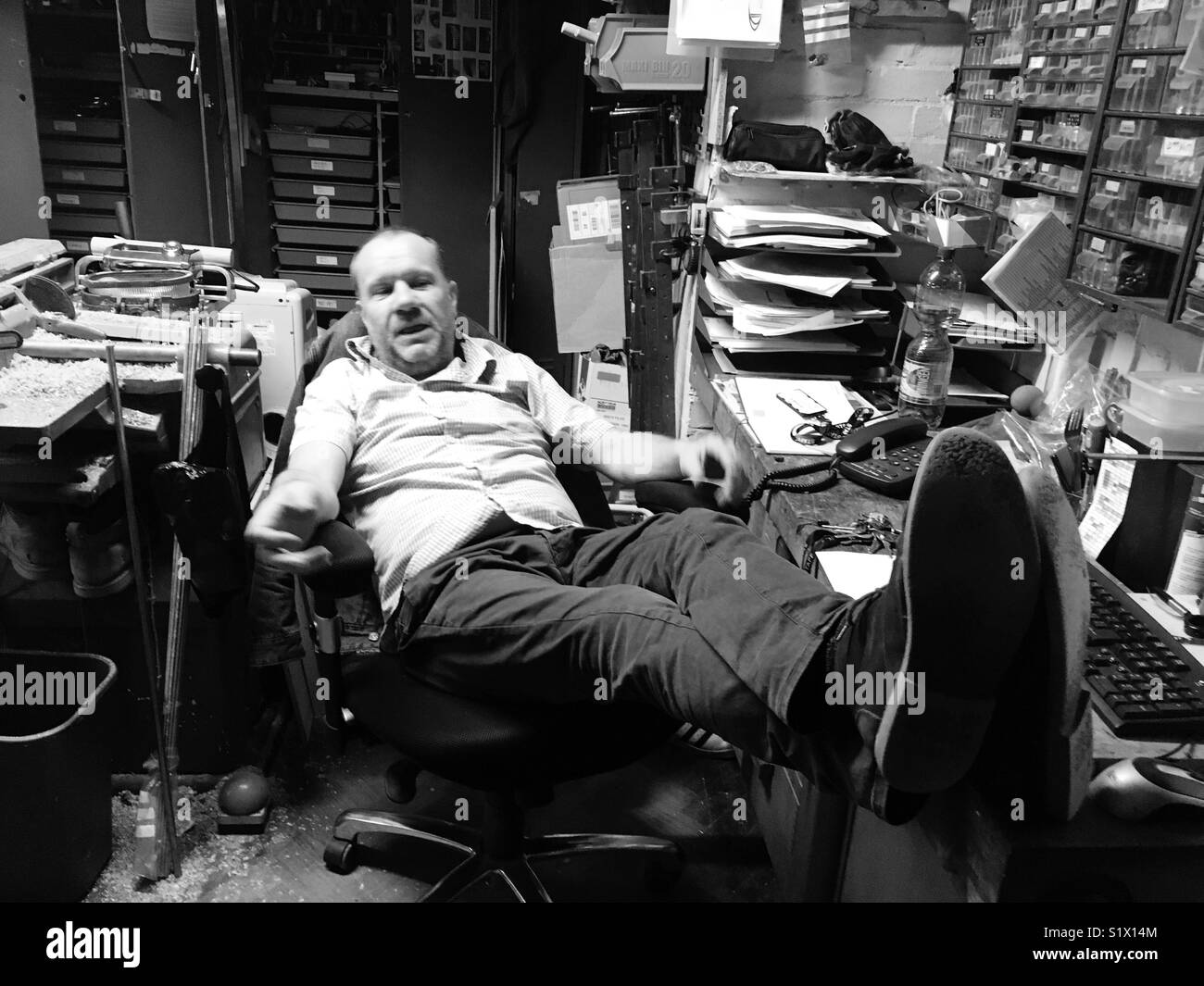 Technician at desk Stock Photo - Alamy