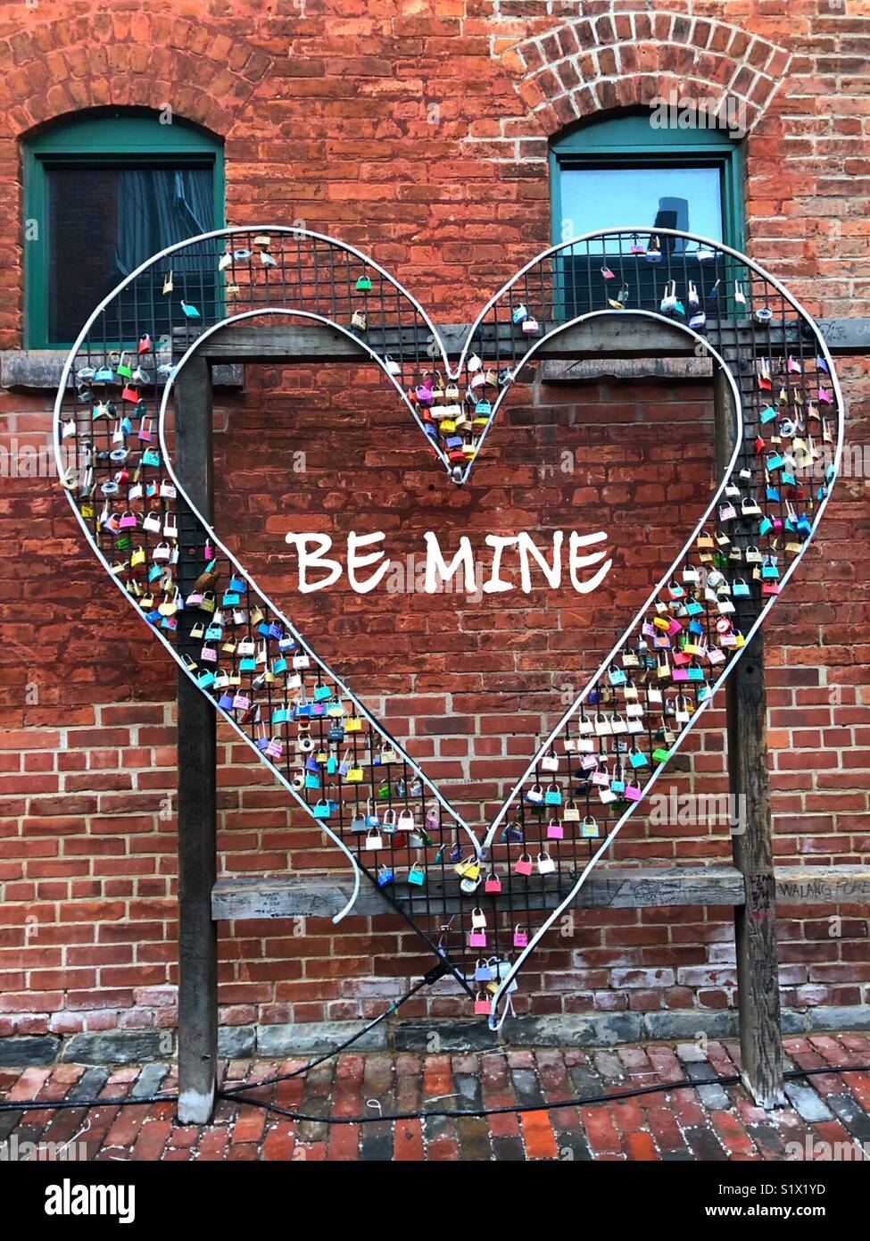 Be Mine written on a brick wall in a heart Stock Photo - Alamy