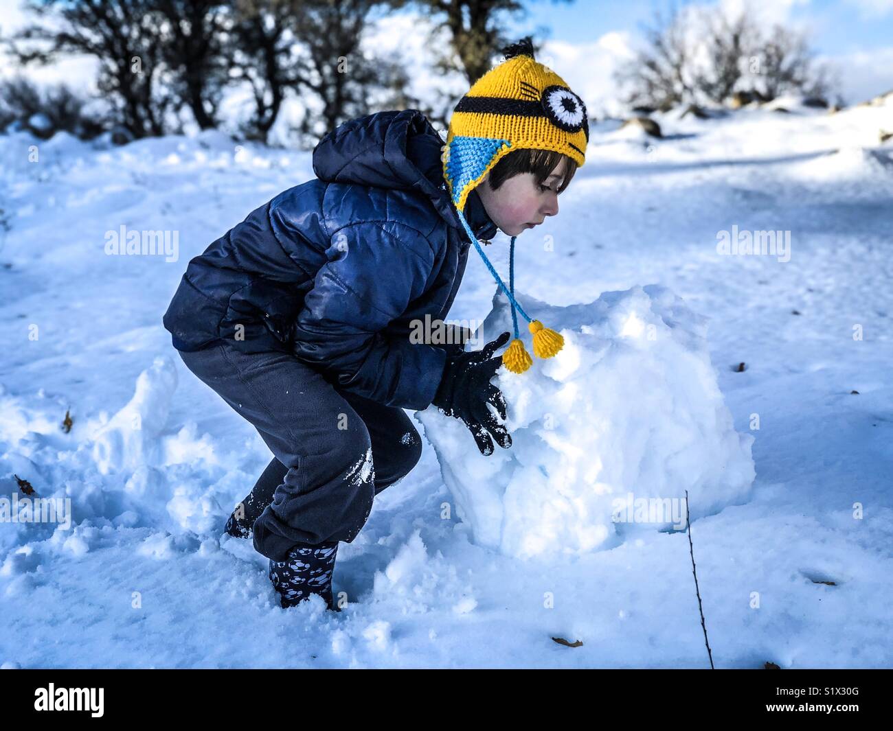 Rolling the snowball hi-res stock photography and images - Alamy