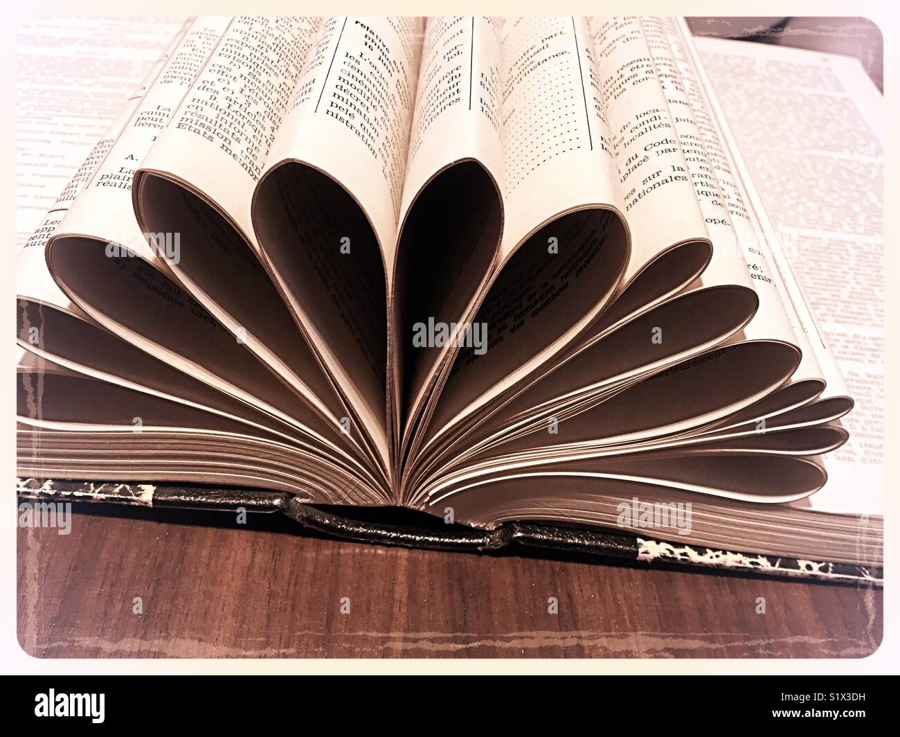 Hardbound book has turned pages Stock Photo - Alamy