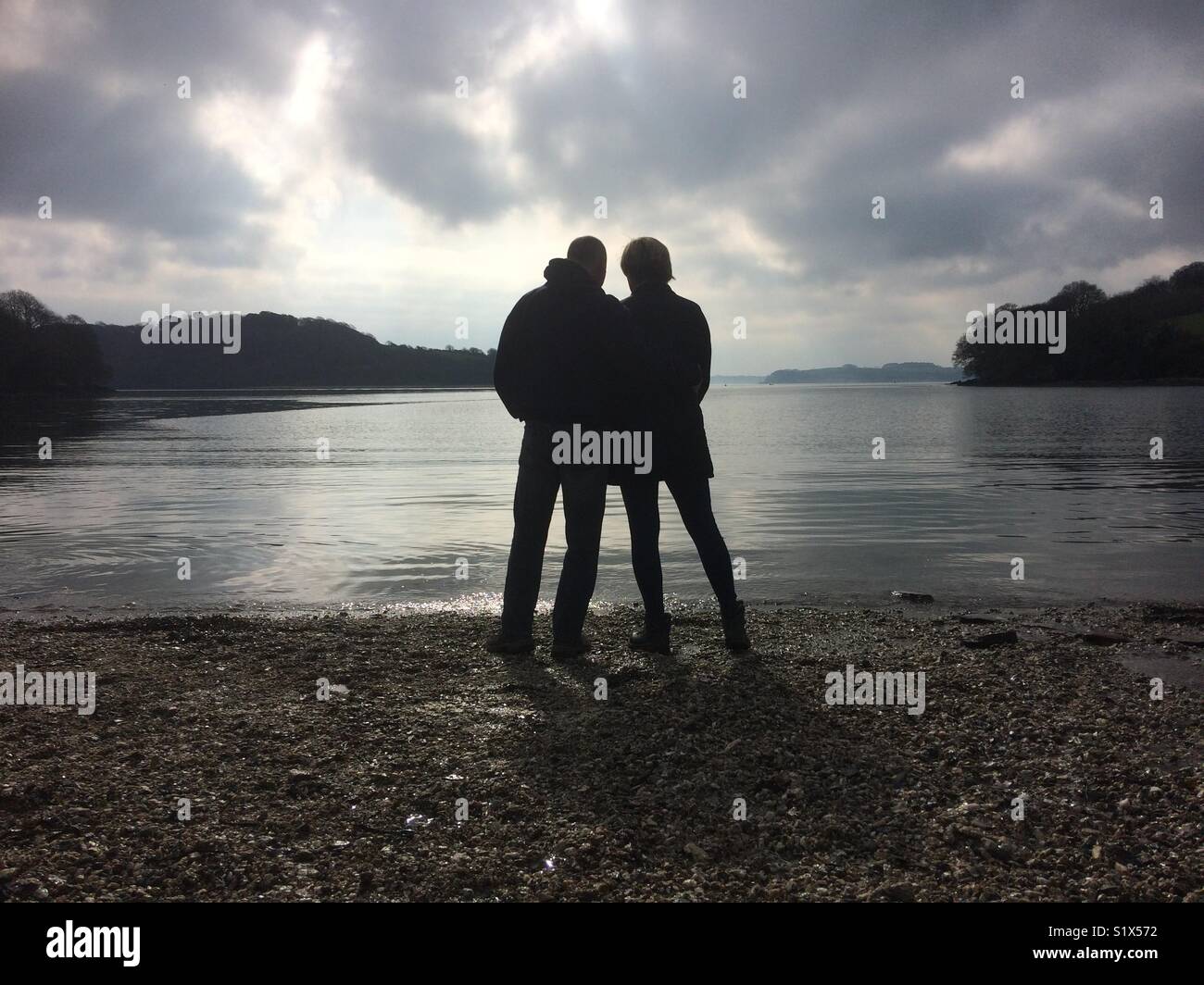 Silhouette couples looking sea view hi-res stock photography and images ...