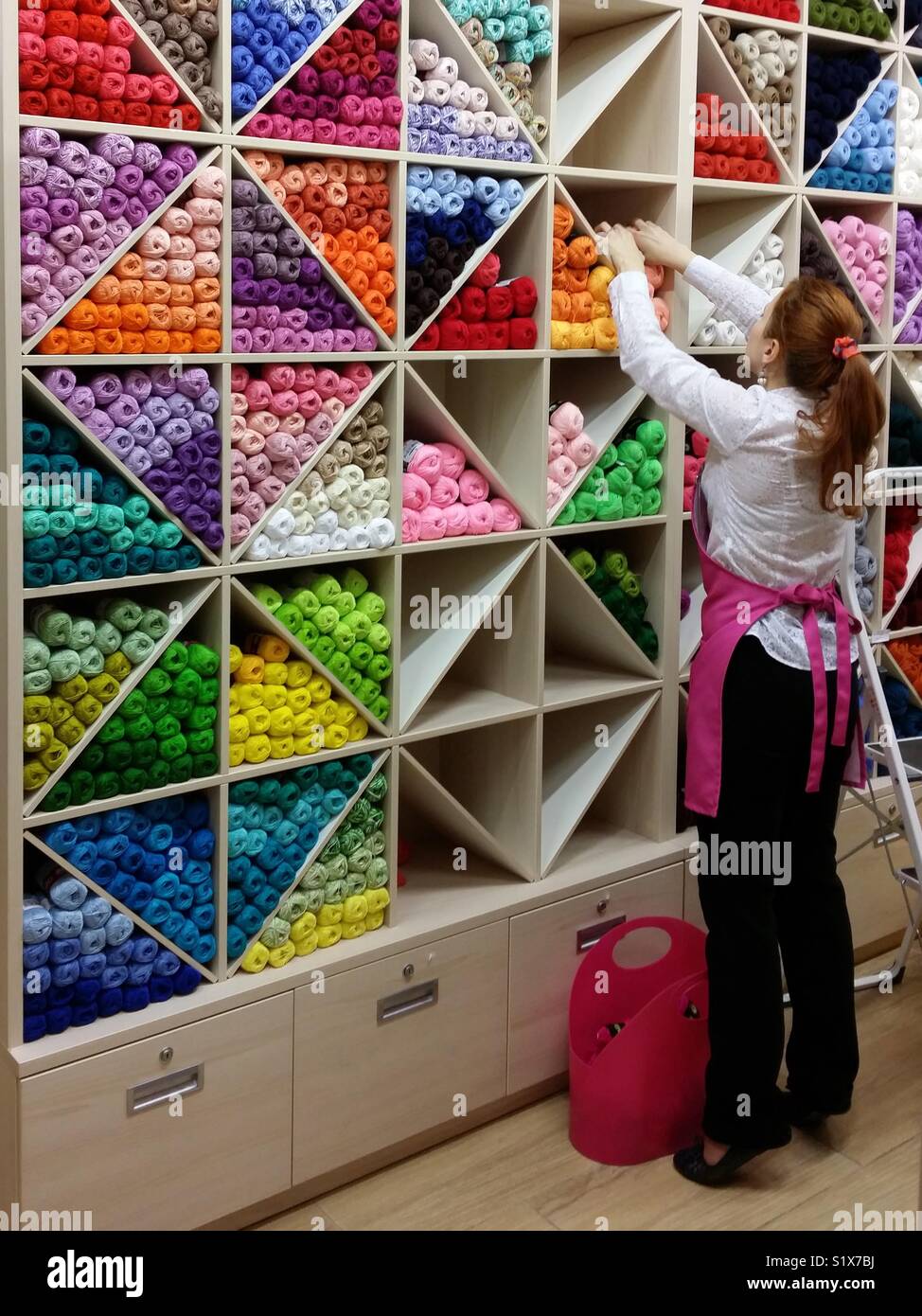 Stack of colorful yarn in boutique showcase Stock Photo - Alamy