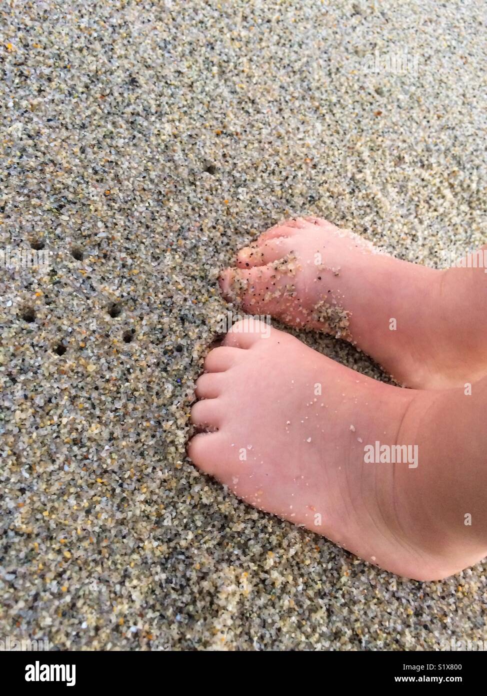 Child feet sand hi-res stock photography and images - Alamy