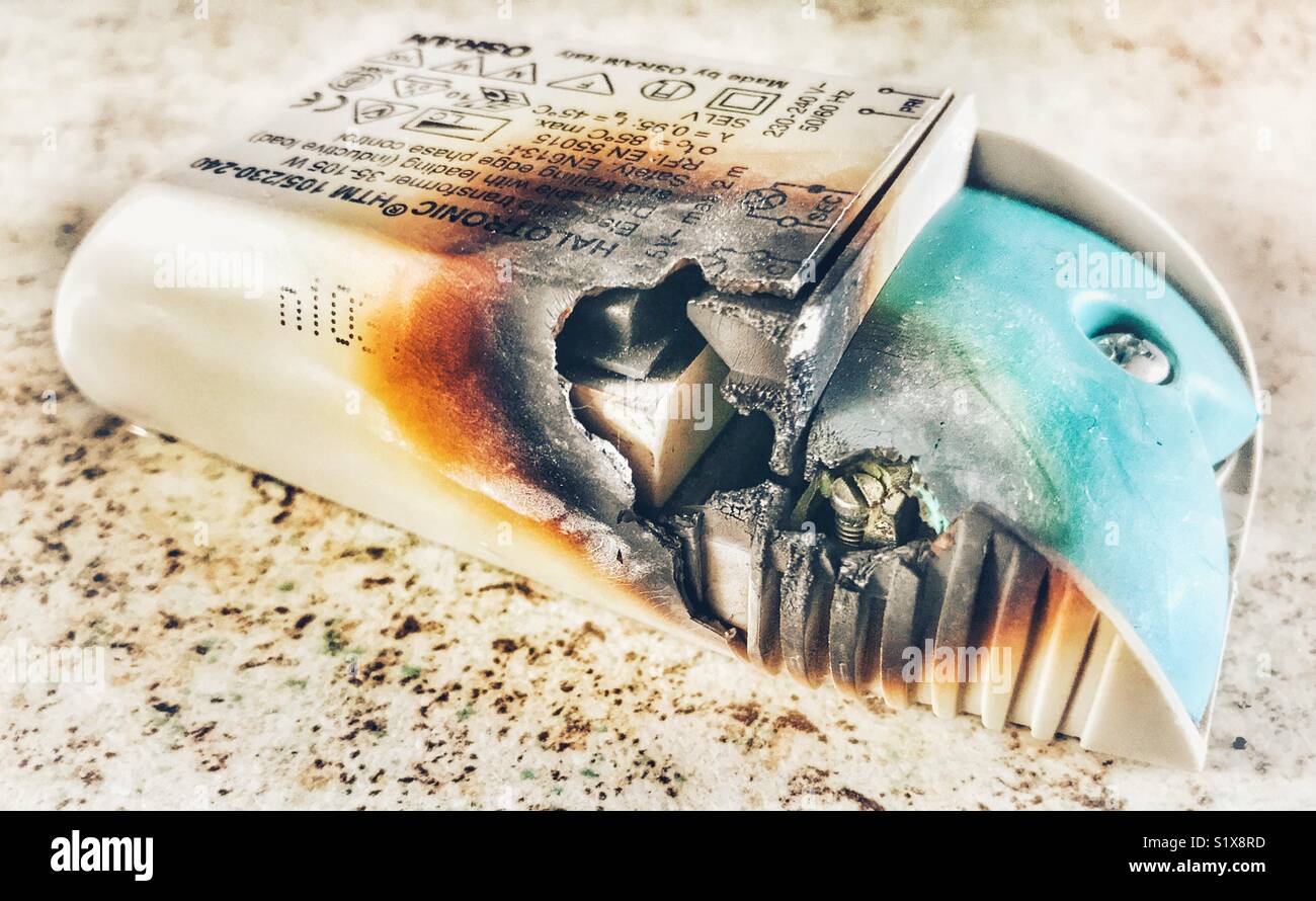 A burnt out transformer, could cause a house fire Stock Photo - Alamy