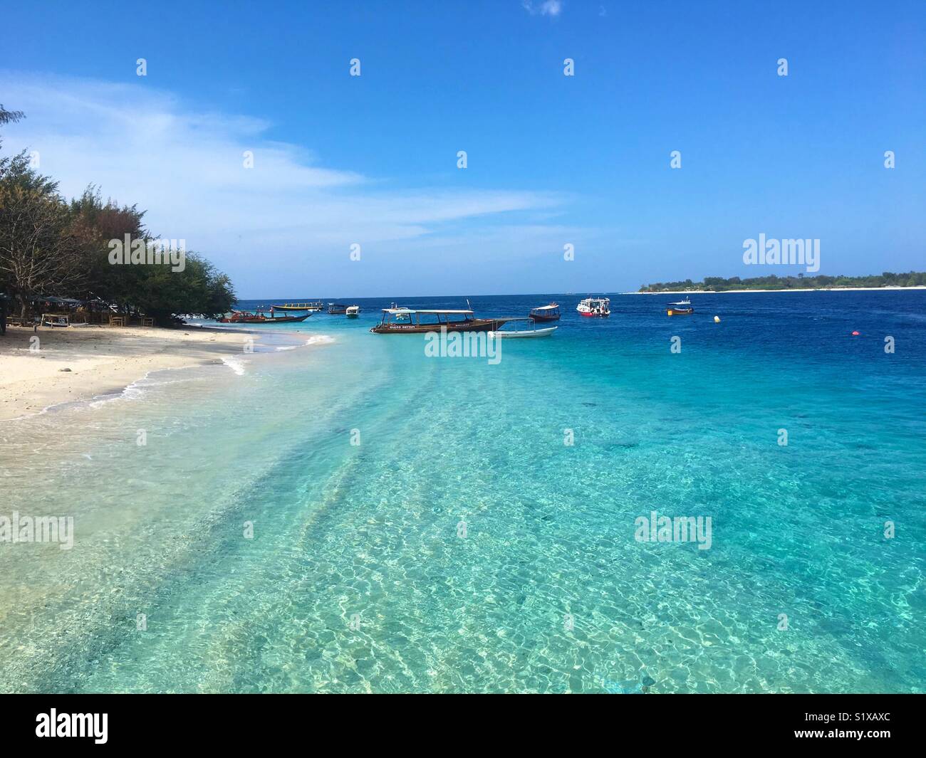 Paradise Island. Turquoise waters, White sands, Blue Sky’s Stock Photo ...