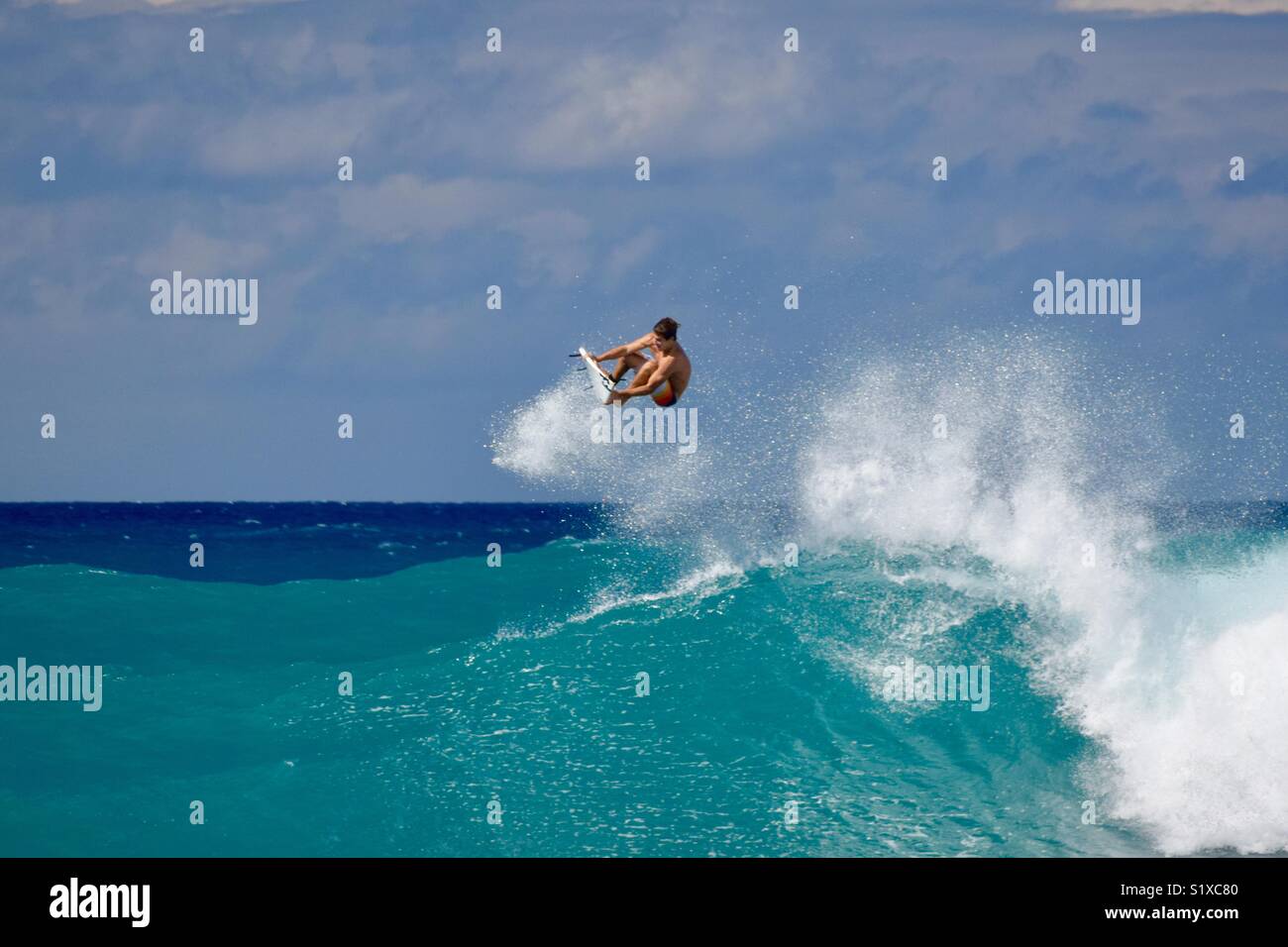 Riding the waves Stock Photo - Alamy