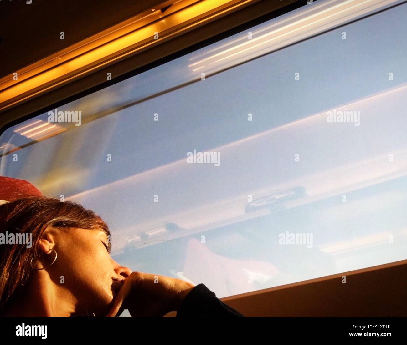 Girl sleeping on train hi-res stock photography and images - Alamy