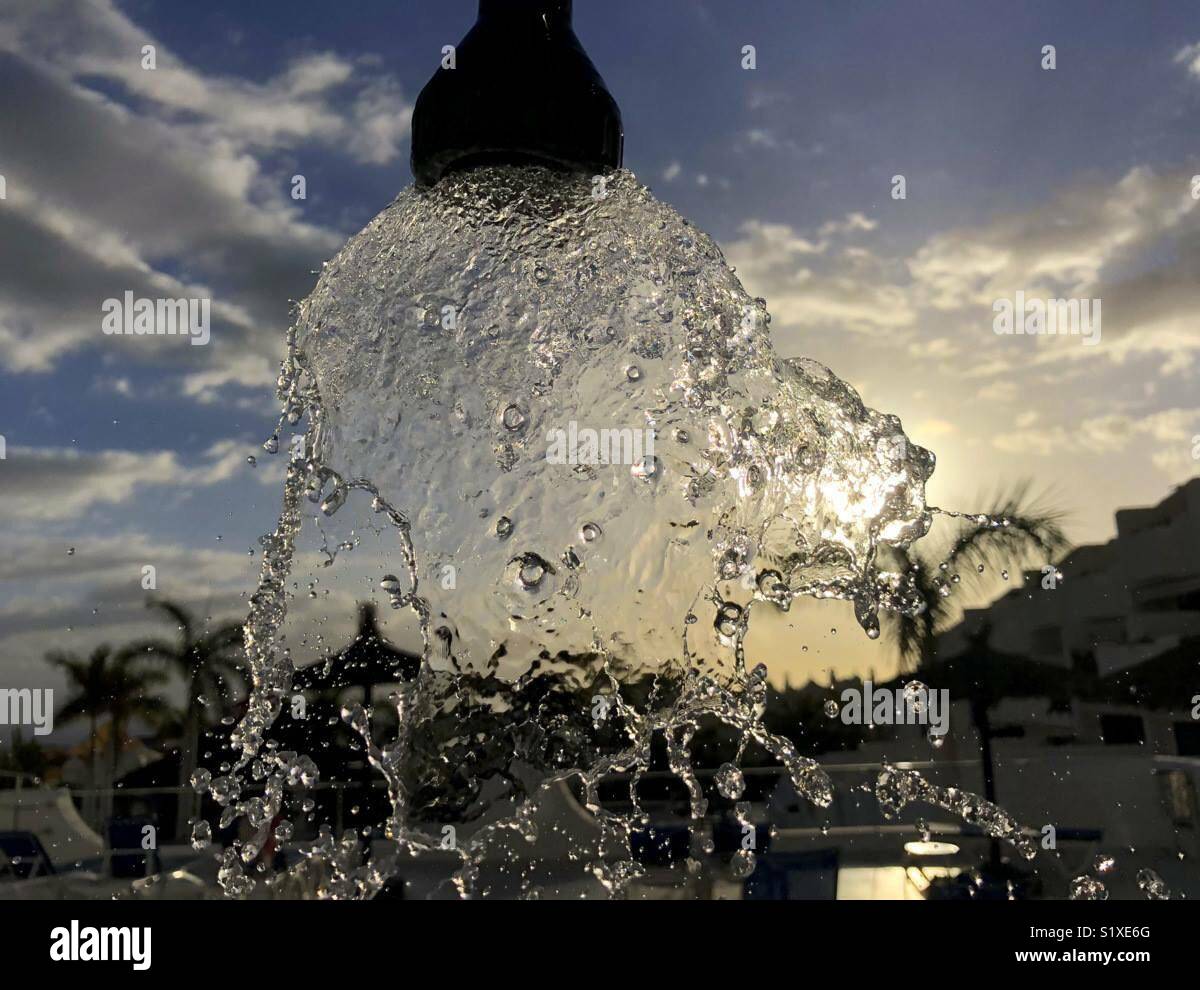 Sun shining through swimming pool shower Stock Photo - Alamy