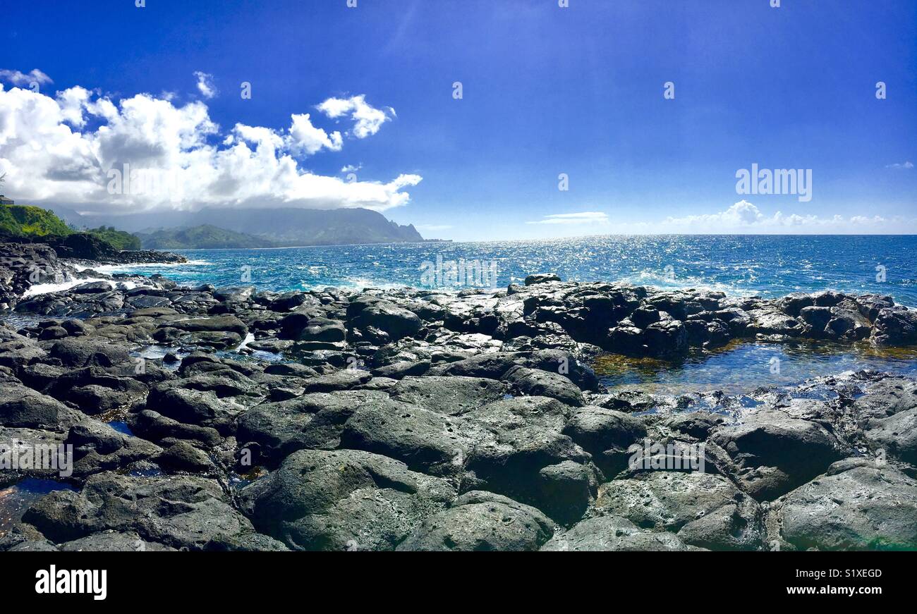 Lava rocks on island seashore Stock Photo - Alamy