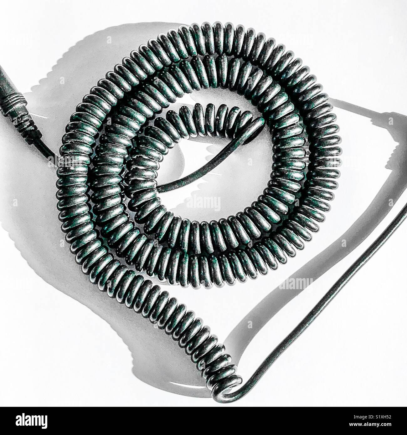Spiral of a coiled audio extension lead Stock Photo - Alamy