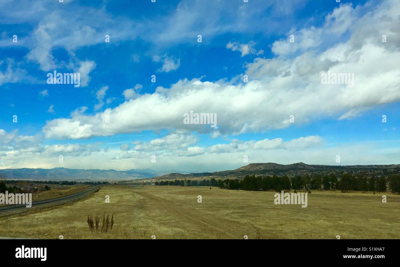 Prairie landscape with clouds drifting overhead before approaching ...