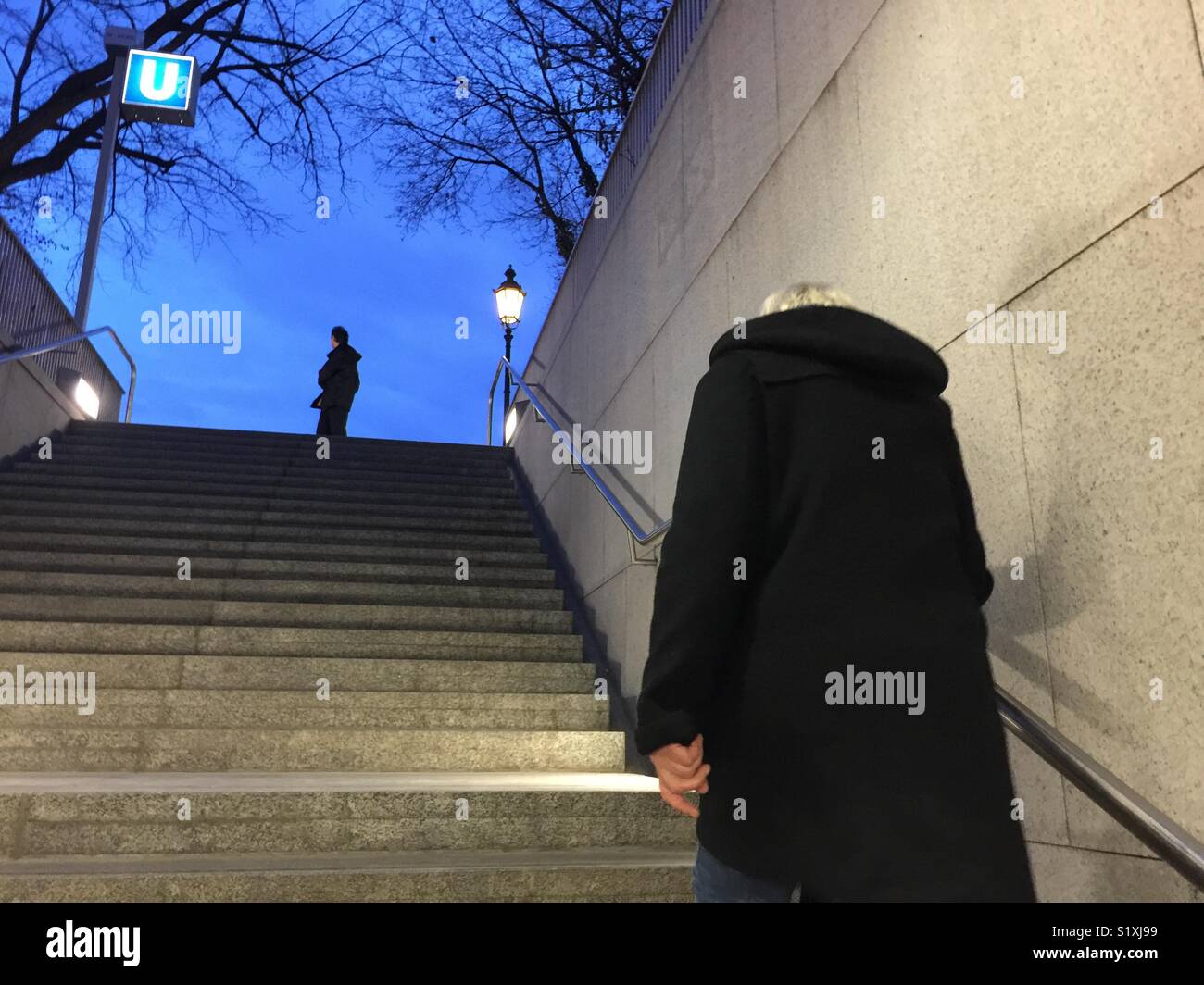 Woman climbing stairs hi-res stock photography and images - Alamy