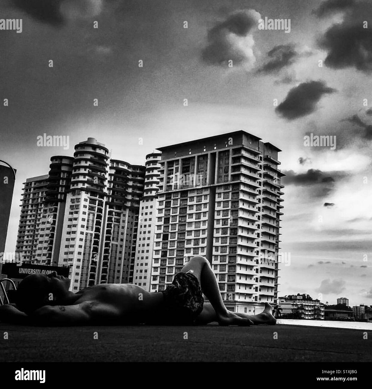 Laying down at the pool Stock Photo - Alamy