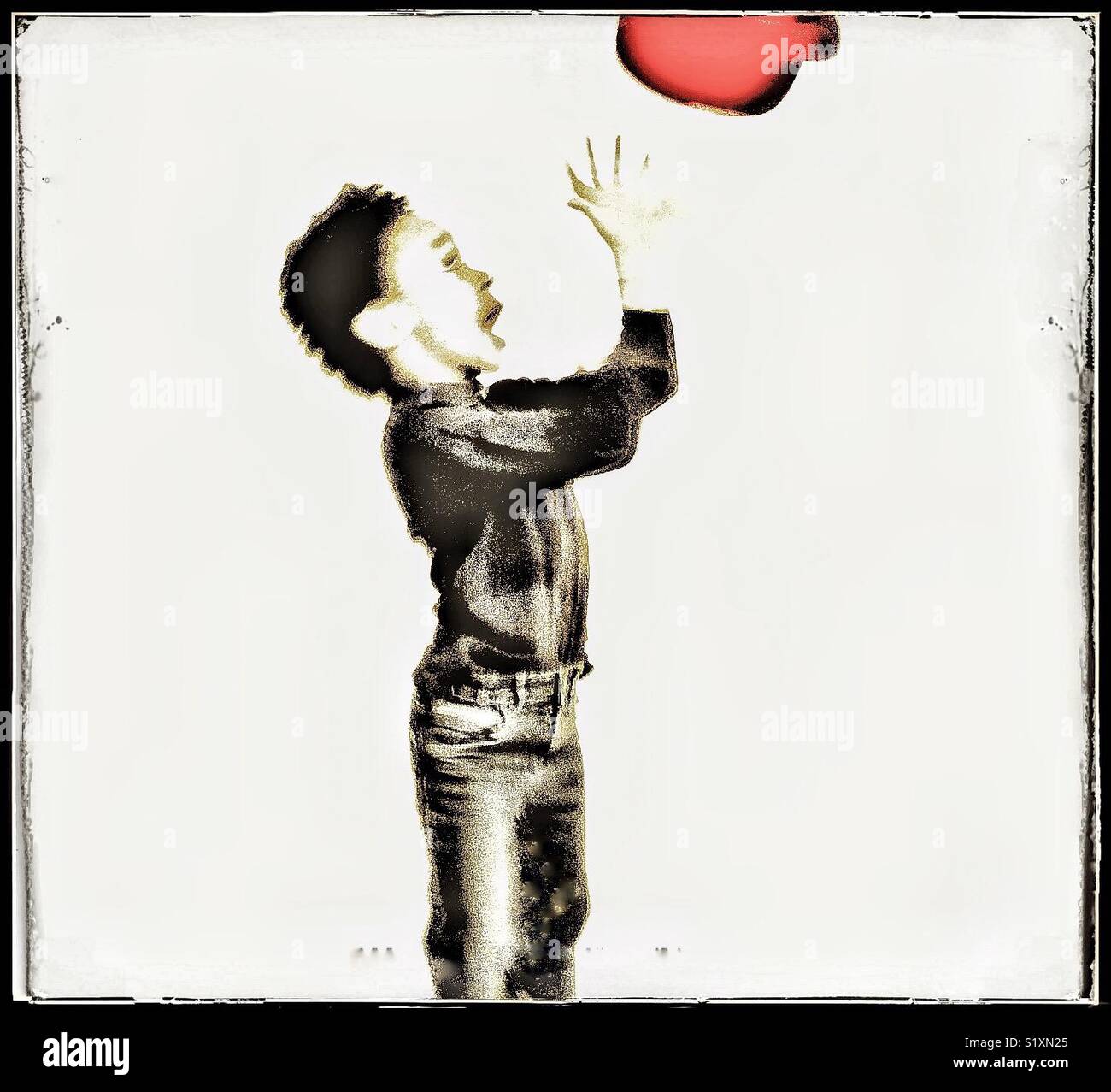 A young boy throws his hat into the air Stock Photo - Alamy