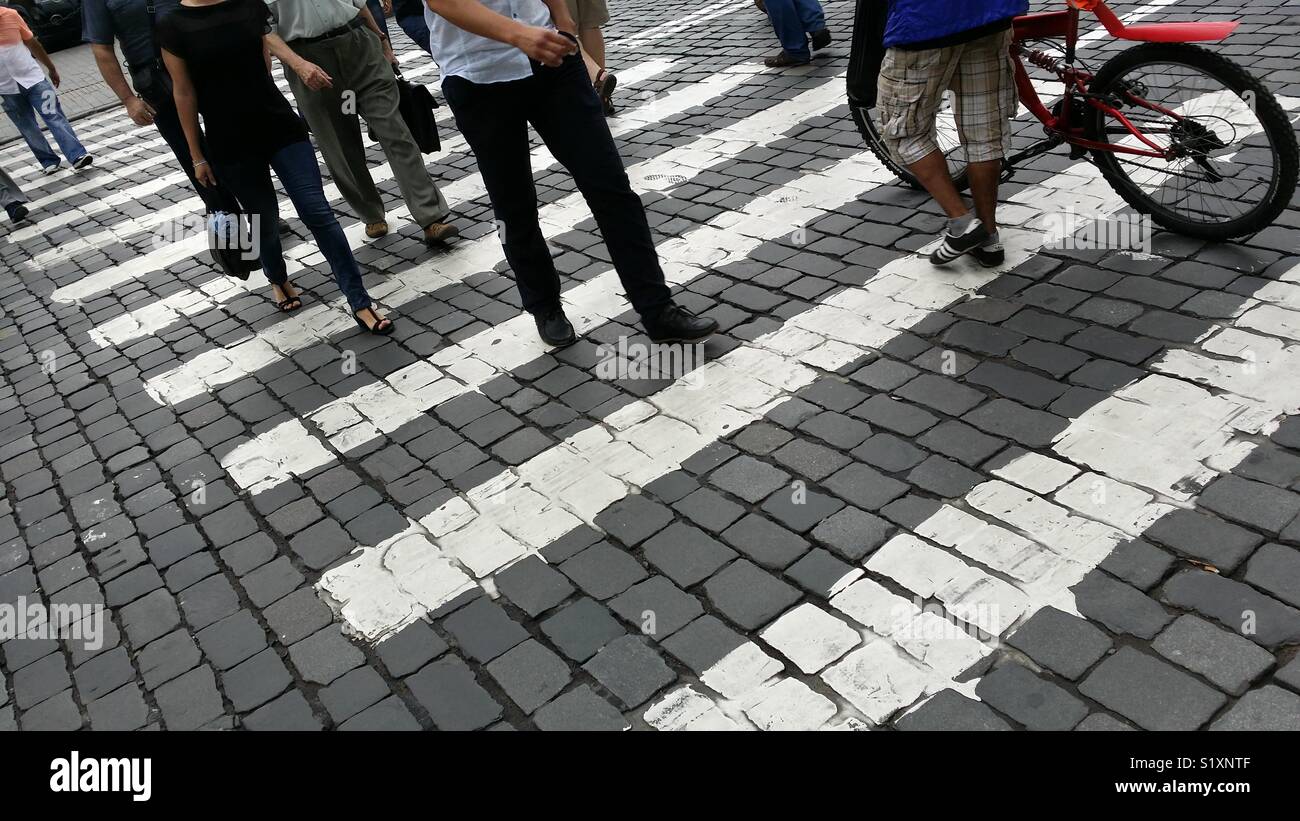 Woman walking cobblestone crosswalk hi-res stock photography and images ...