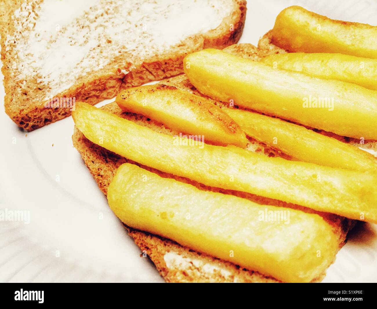 Chips on wholemeal bread Stock Photo - Alamy