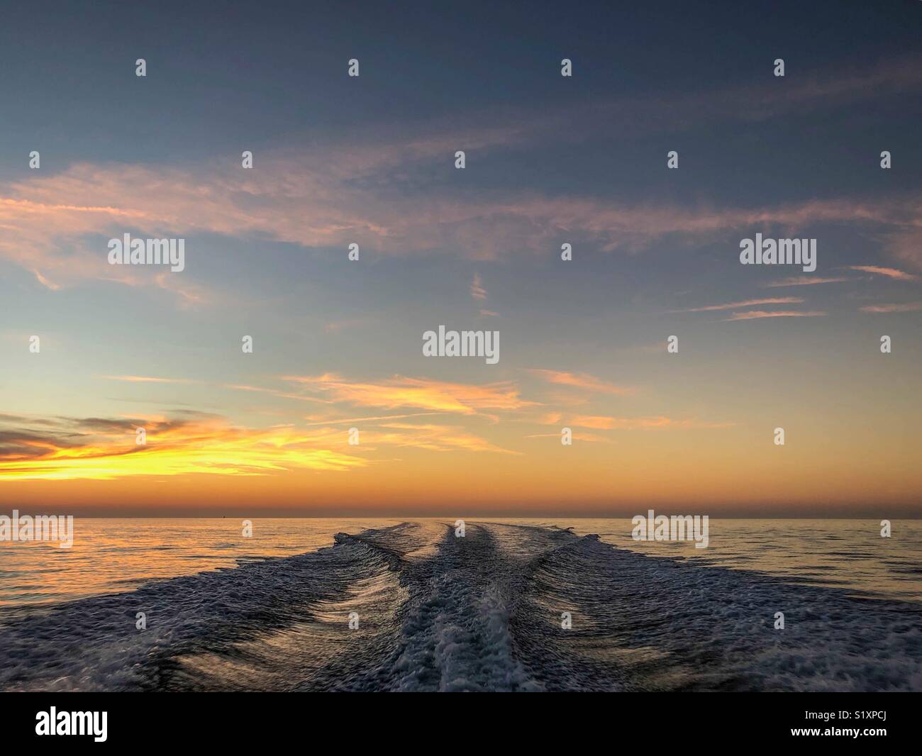 Boat wake sunset hi-res stock photography and images - Alamy