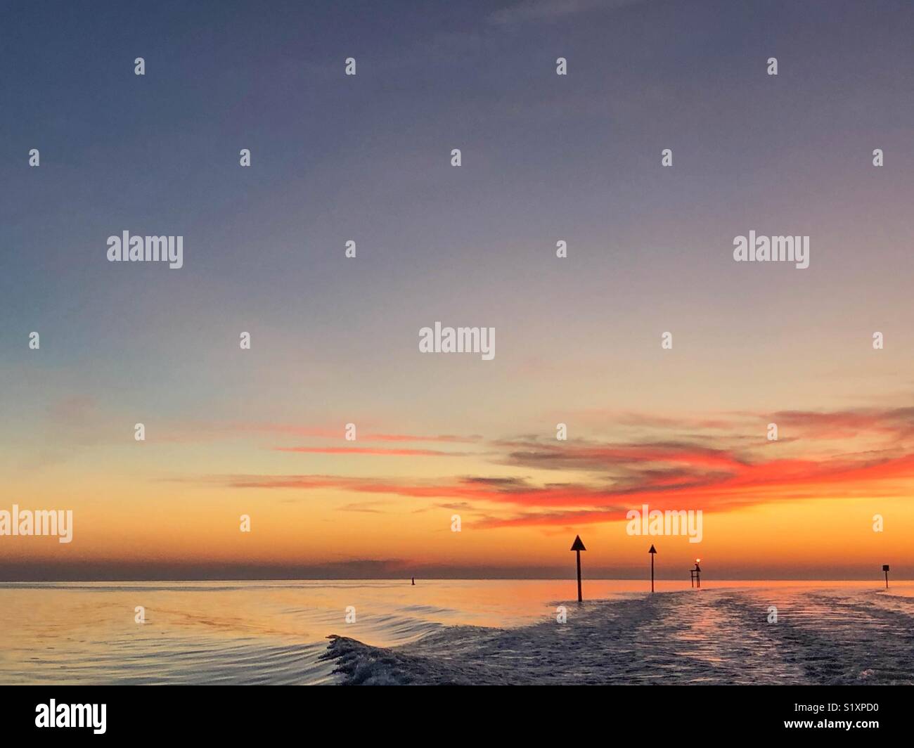 Wake of boat at sunset in Hernando Beach, Florida Stock Photo - Alamy