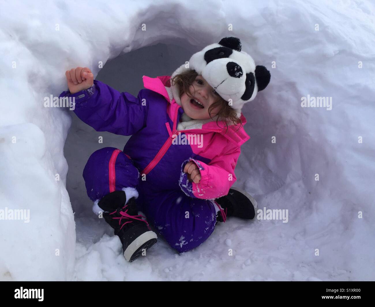 Little girl having fun on the snow Stock Photo - Alamy