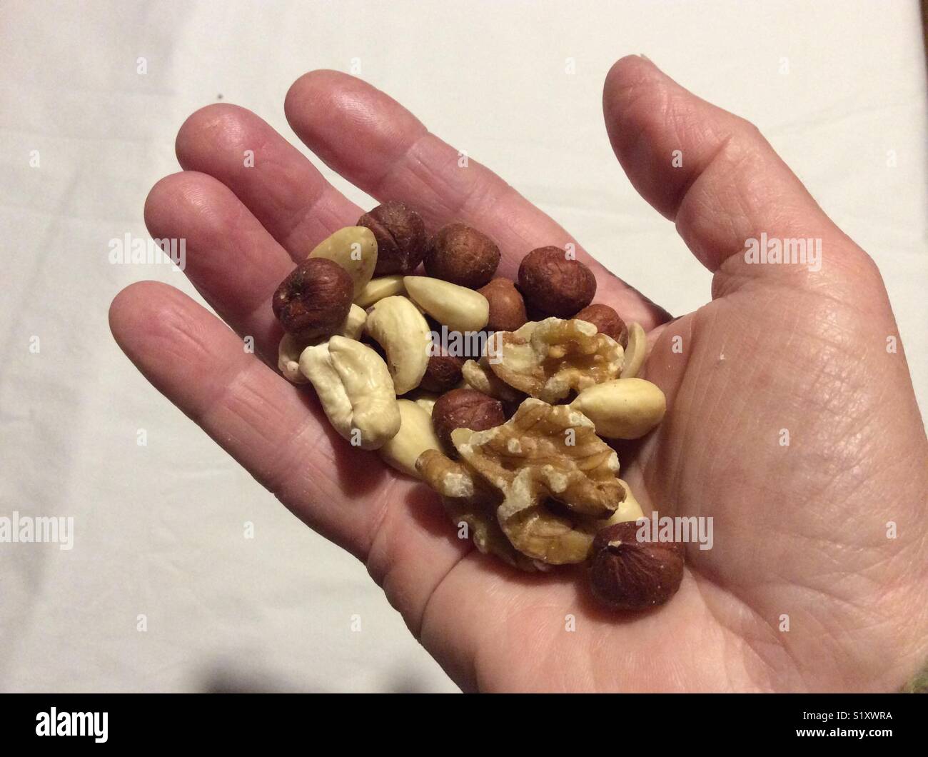 Handful mixed nuts hi-res stock photography and images - Alamy