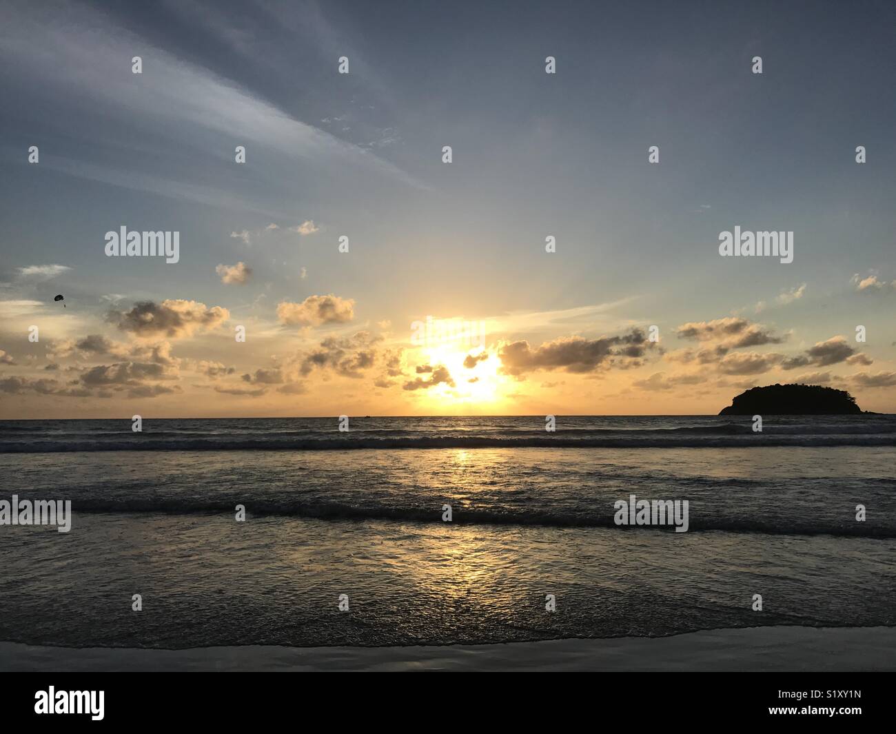 A sunset at a beach in phuket Thailand Stock Photo - Alamy