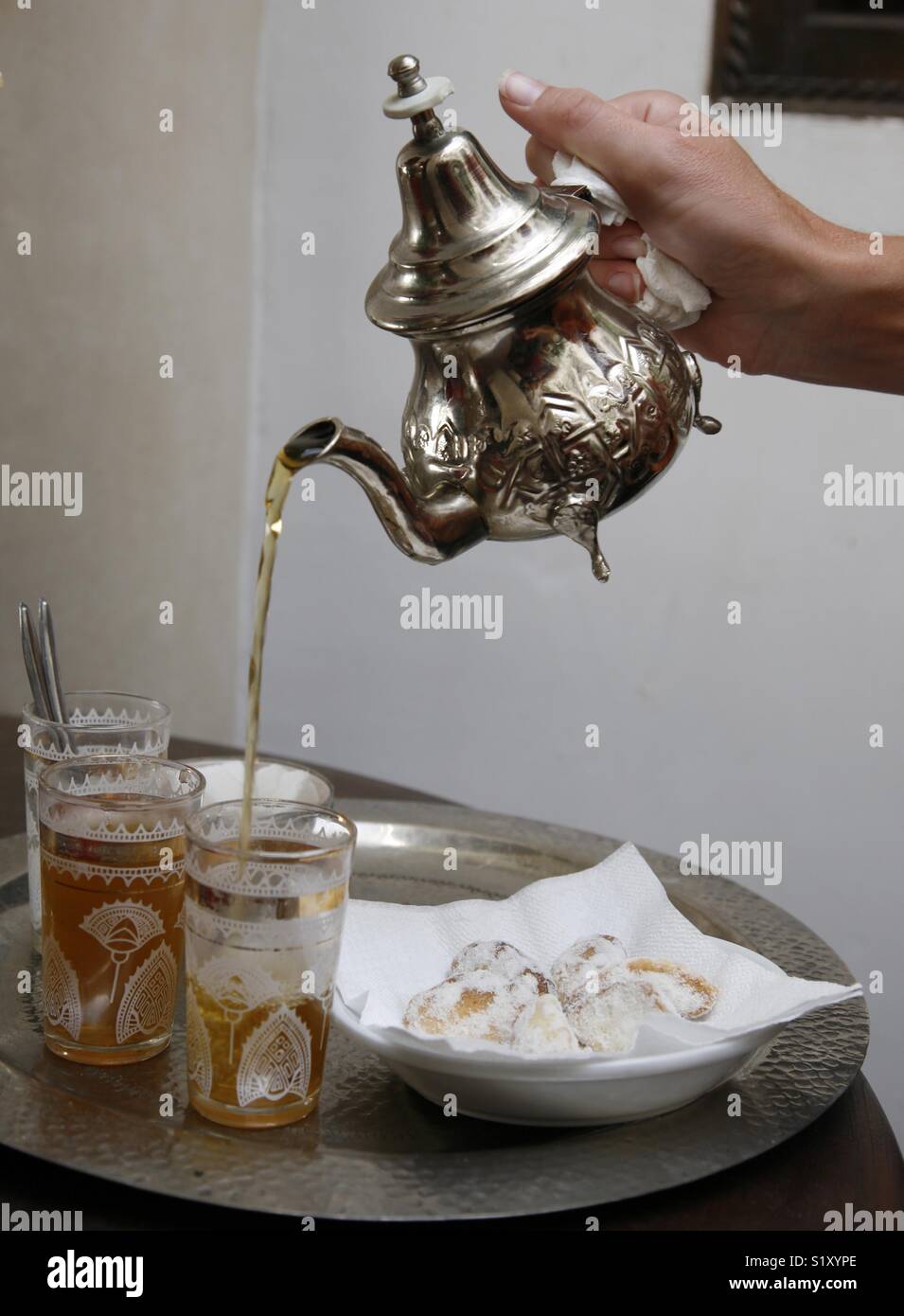 Moroccan tea and cookies are served in a riad in Marrakech, Morocco ...