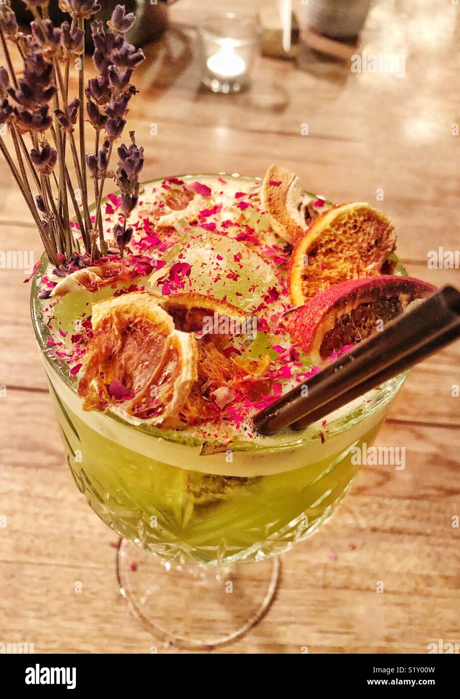 A coctail glass on wooden table Stock Photo - Alamy