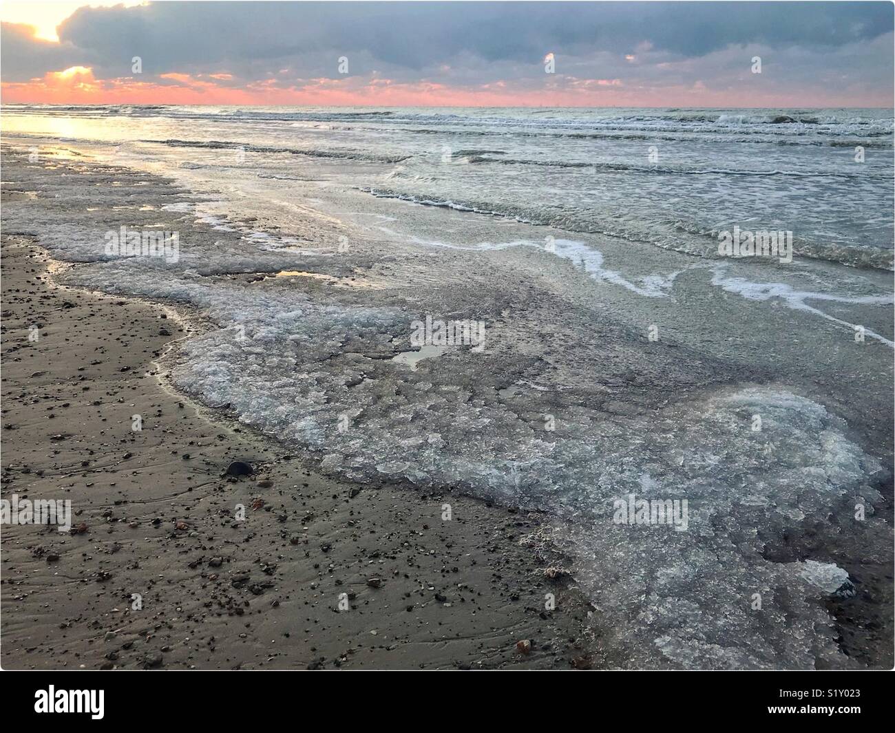 Ice on the beach Stock Photo - Alamy