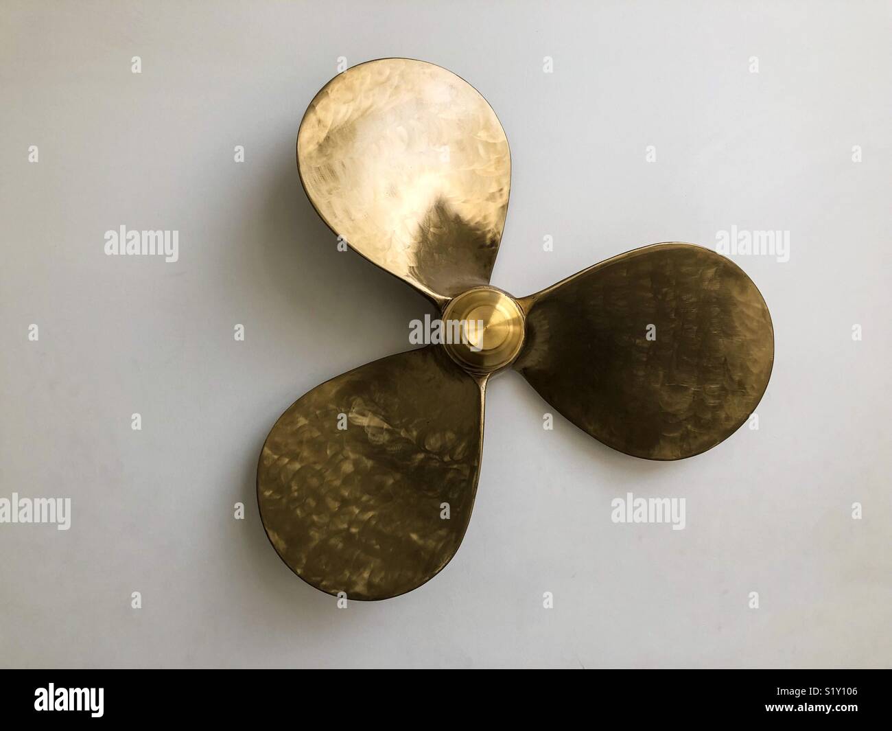 Golden Propeller on a Wall Stock Photo - Alamy