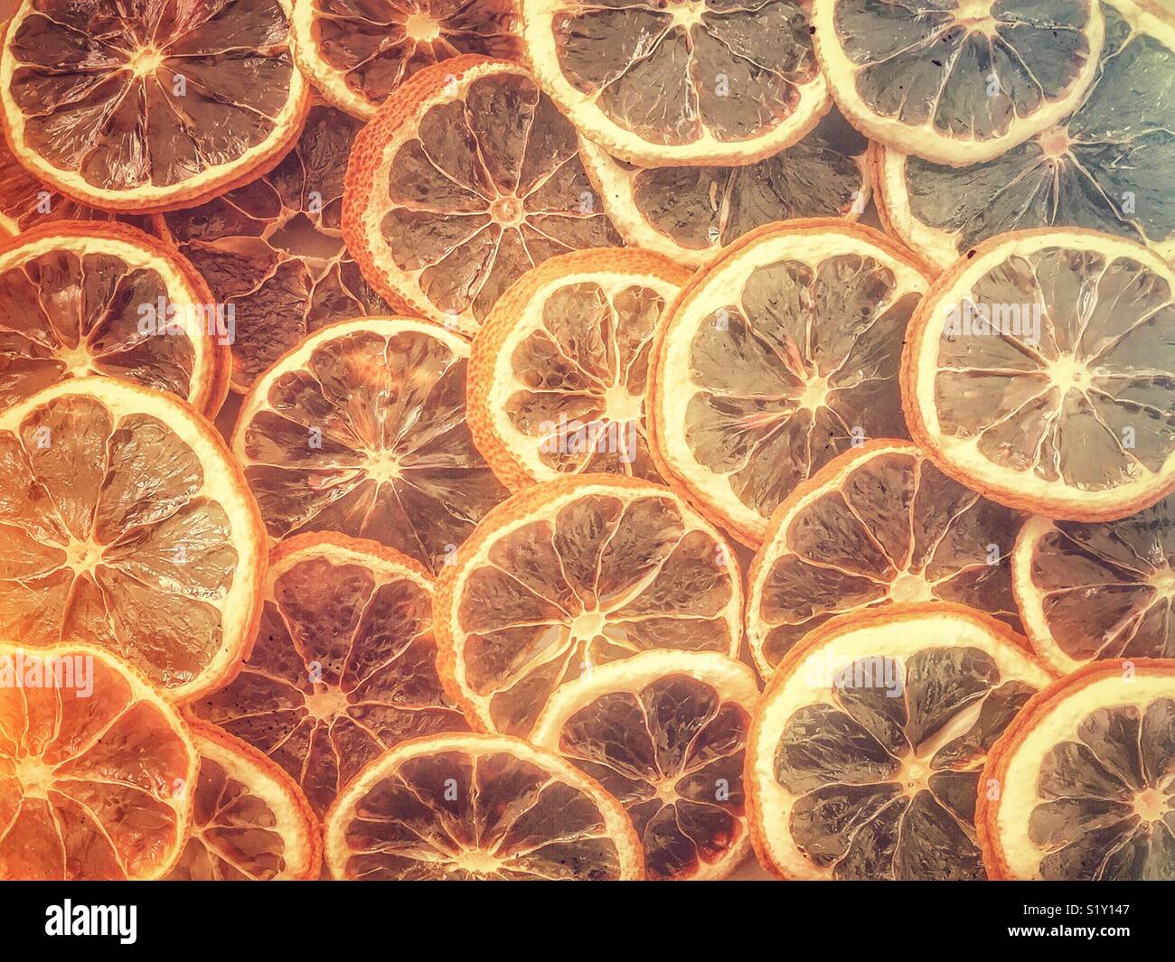 Dried citrus slices background Stock Photo - Alamy