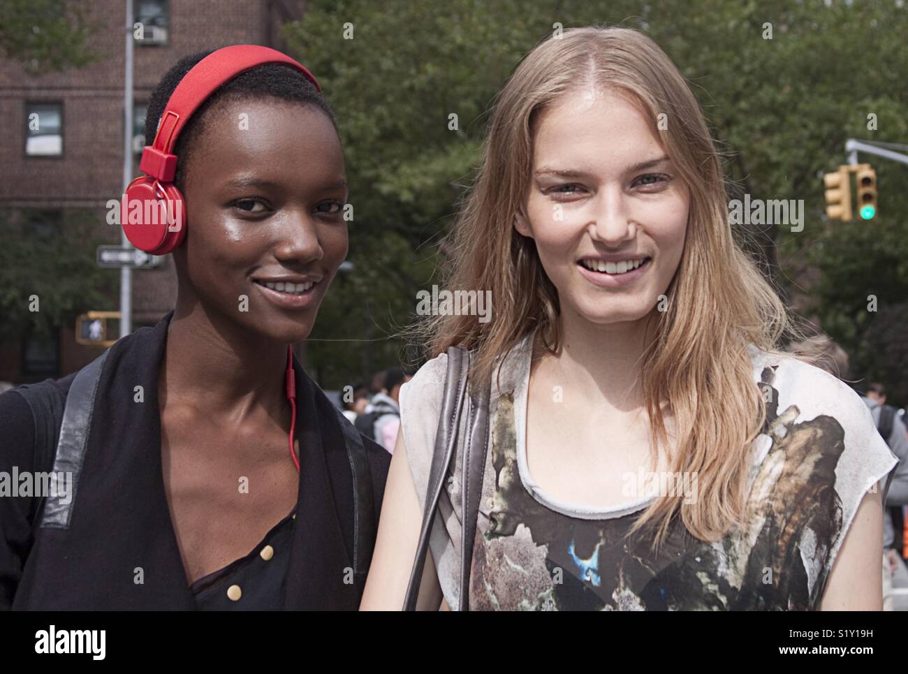 Two fashion models smiling Stock Photo - Alamy